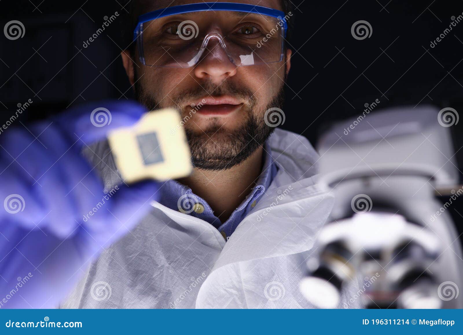 Worker holding microchip stock photo. Image of glass - 196311214