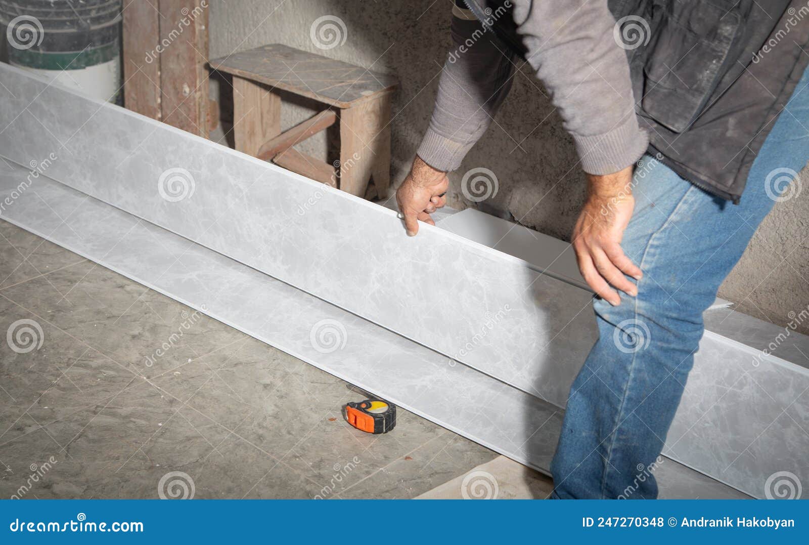 Worker Holding Plastic Panel. Renovating the Ceiling Stock Photo ...