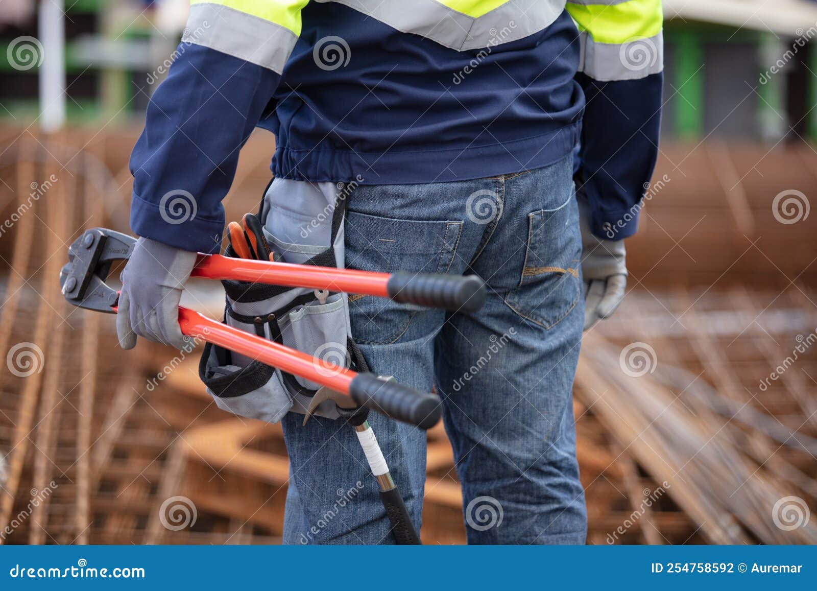 Worker Holding Pliers at Construction Site Stock Photo - Image of ...