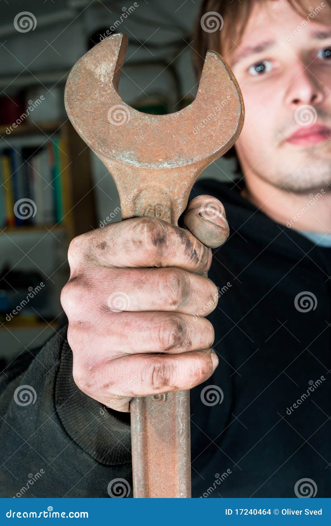 Worker holding spanner stock photo. Image of grasping - 17240464