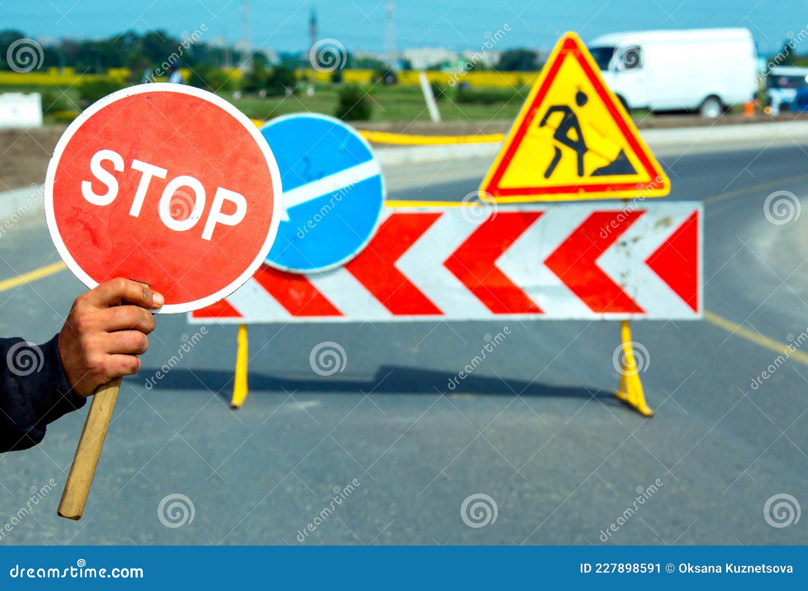 Worker Holding a Stop Sign during Road Construction. Stock Image ...