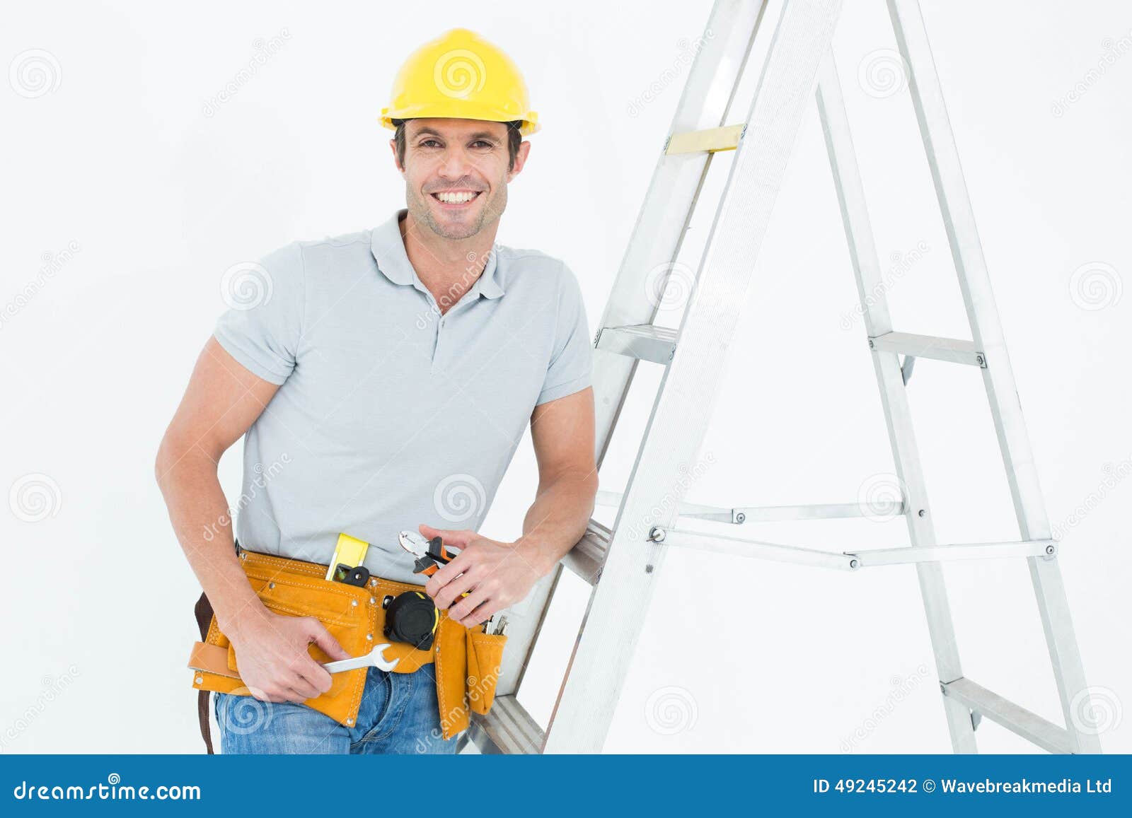 Worker Holding Tools while Leaning on Step Ladder Stock Photo - Image ...