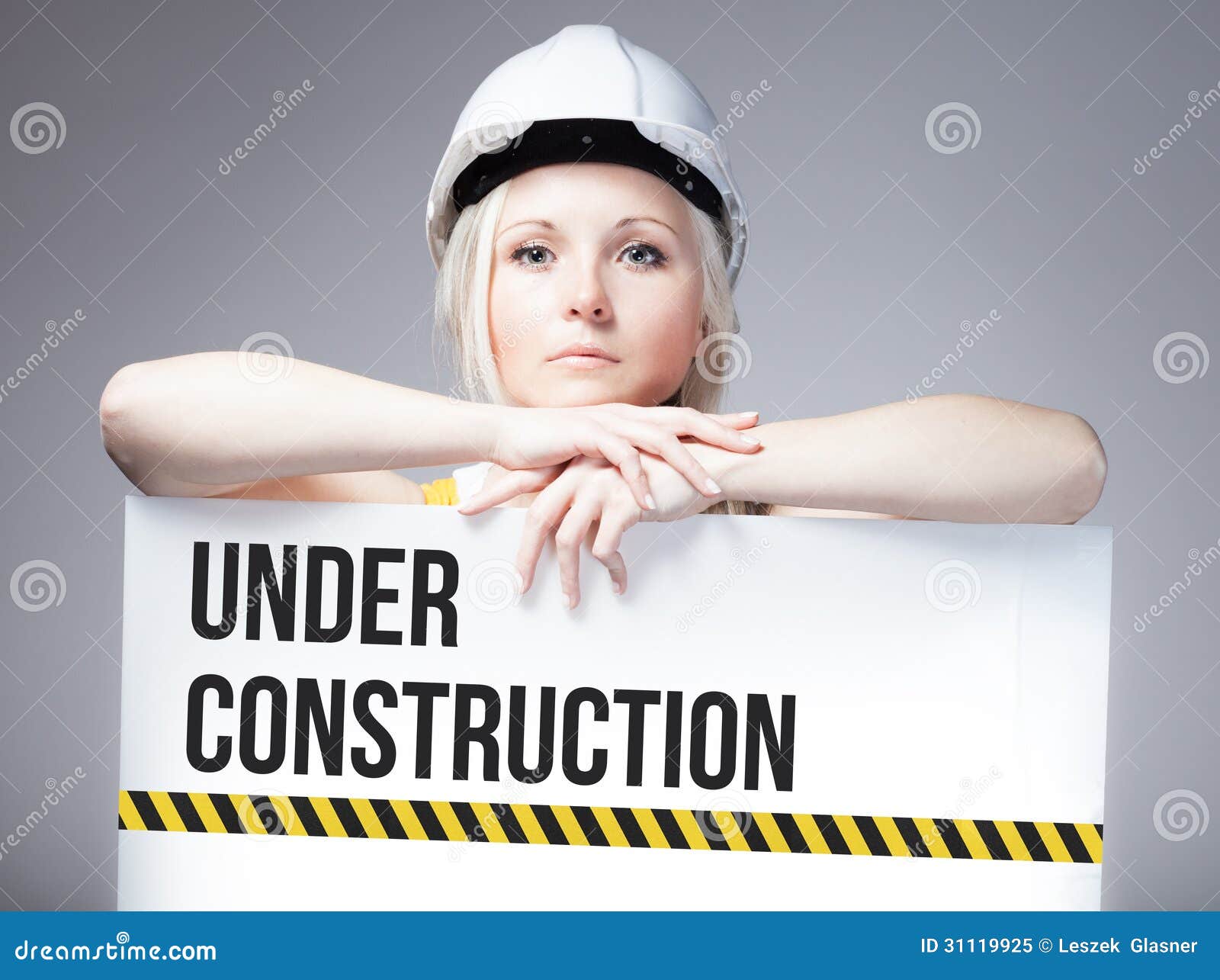 Worker Holding Under Construction Sign on Information Board Stock ...