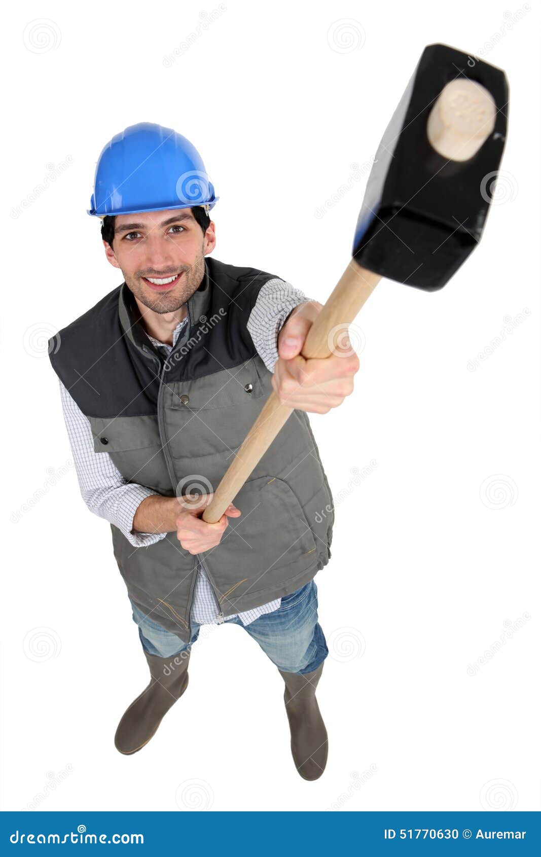 Worker holding up a mallet stock photo. Image of show - 51770630