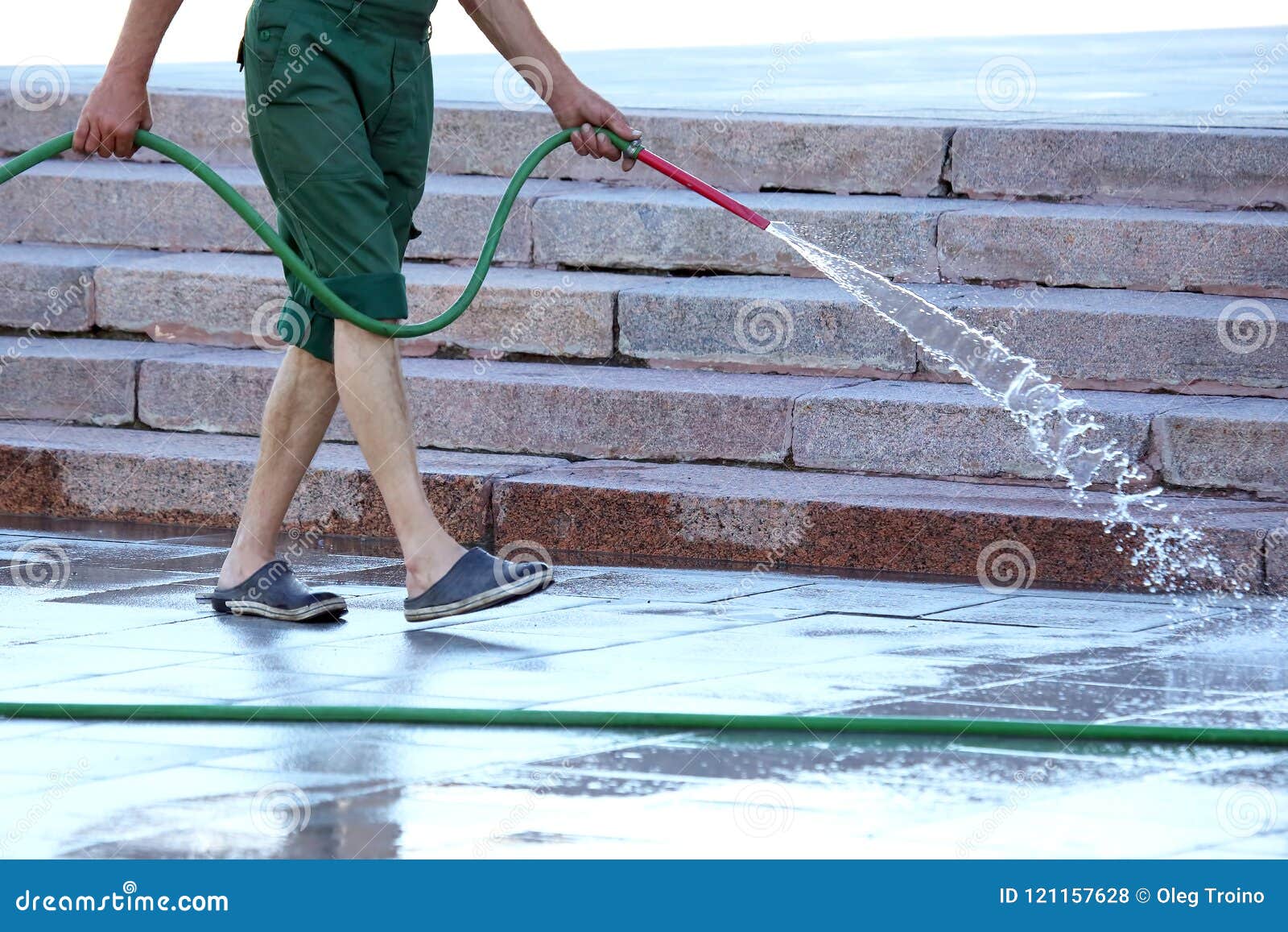 Worker from a Hose Watering the City Street Stock Photo - Image of ...