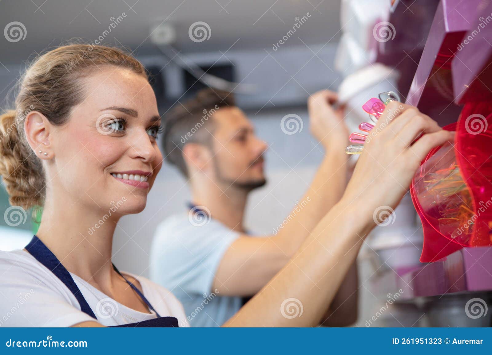 Worker in Ice Cream Parlour Refilling Plastic Spoon Dispenser Stock ...