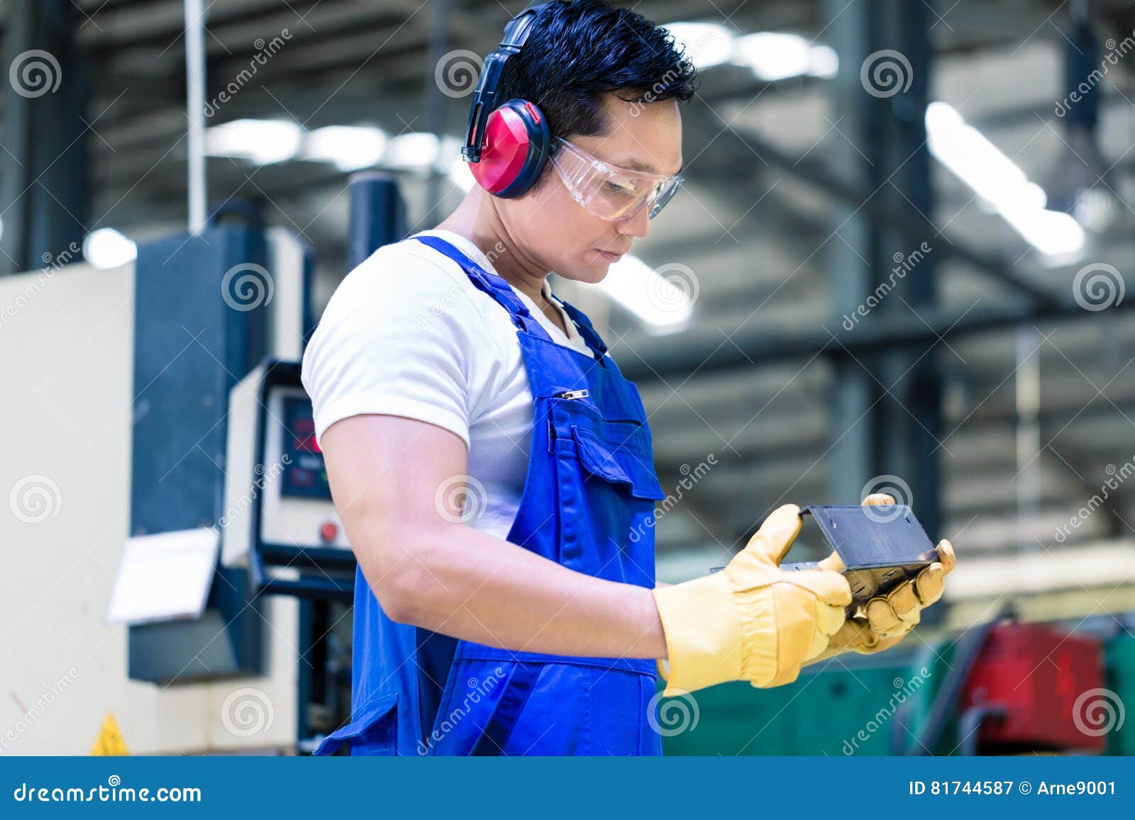 Worker in Industrial Factory Checking Work Piece Stock Image - Image of ...