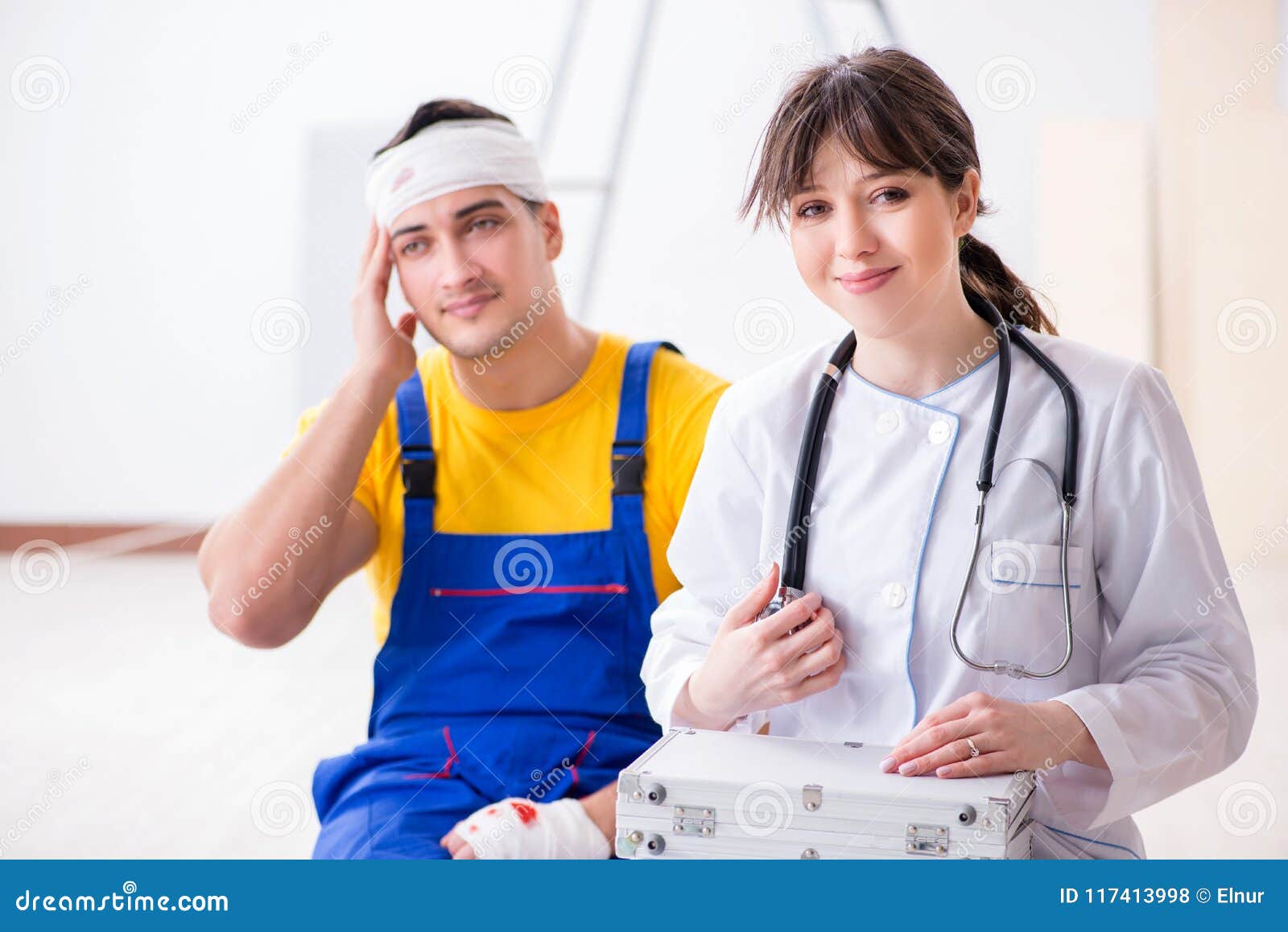 The Worker with Injured Head and Doctor Stock Photo - Image of ...