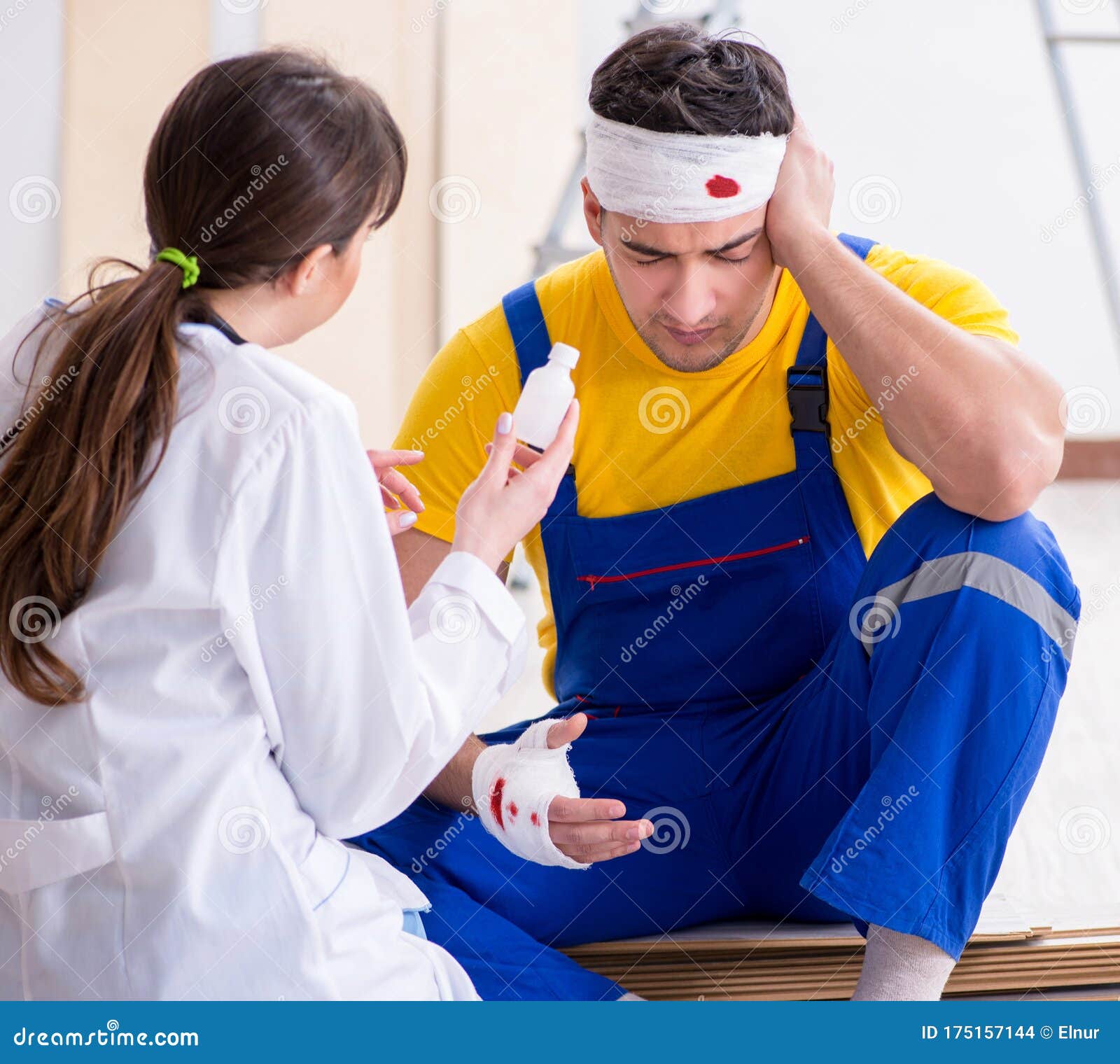 Worker with Injured Head and Doctor Stock Photo - Image of assistance ... Worker with Injured Head and Doctor Stock Photo - Image of assistance ...