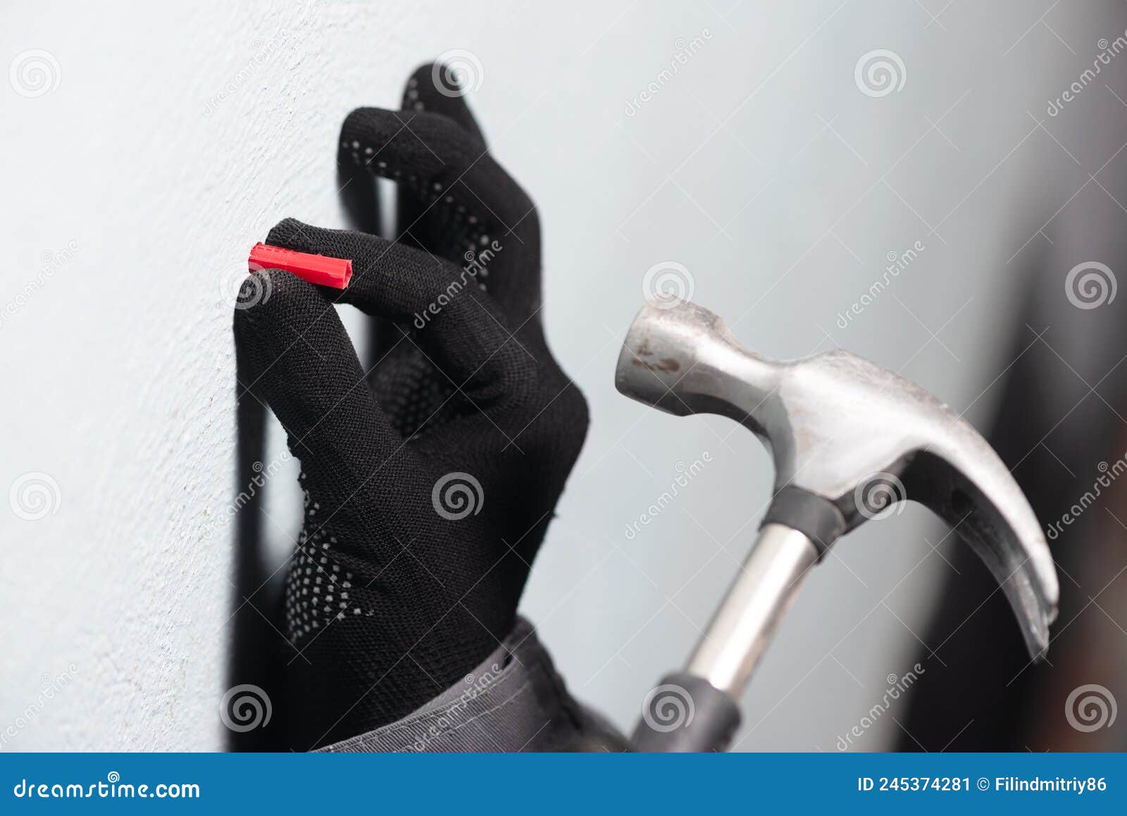 Worker Inserts An Electrical Appliance Plug Into An Extension Cord ...