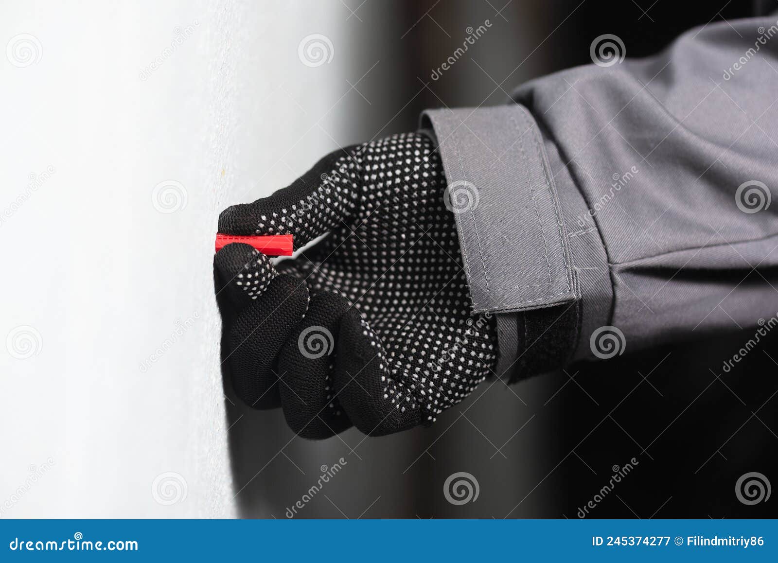 Worker Inserts An Electrical Appliance Plug Into An Extension Cord ...