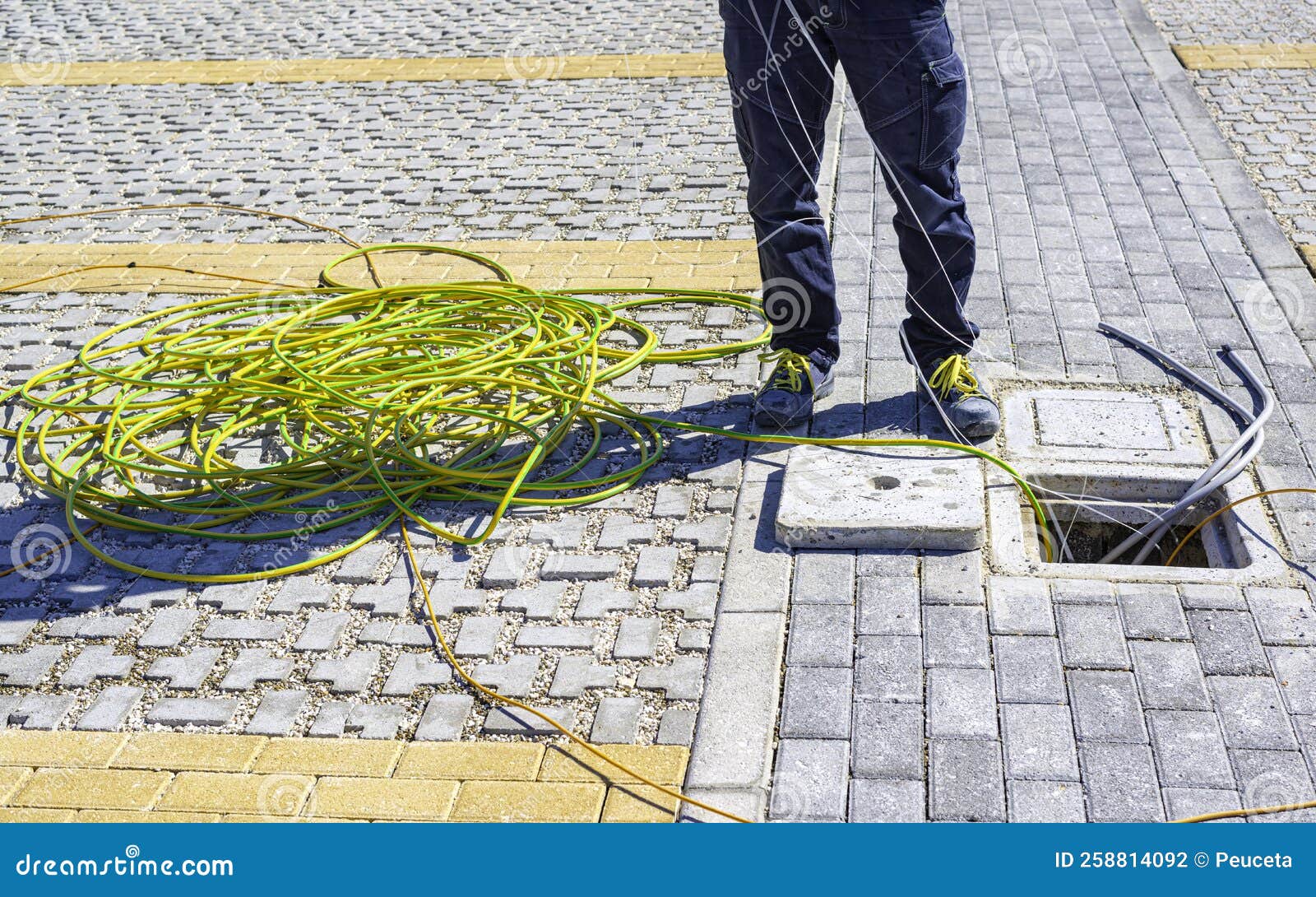 Worker Inserts Connector Of A TV Antenna Coaxial Cable To A Splitter ...