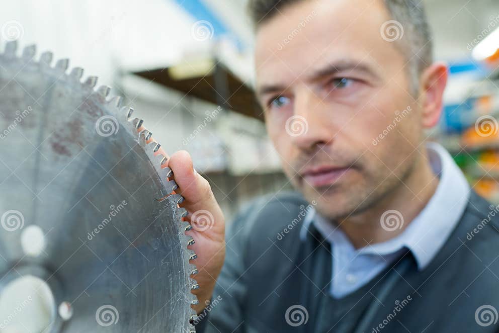Worker Inspecting Blade Circular Saw Stock Photo - Image of hardware ...