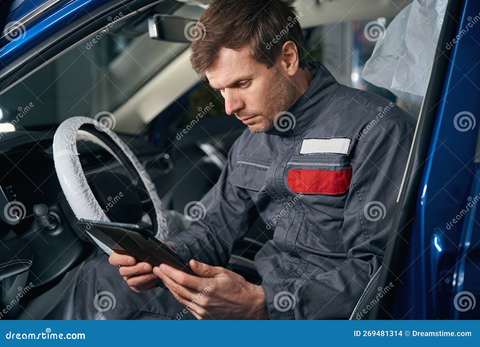 Worker Inspecting Board Computer System in the Workshop Stock Photo ...