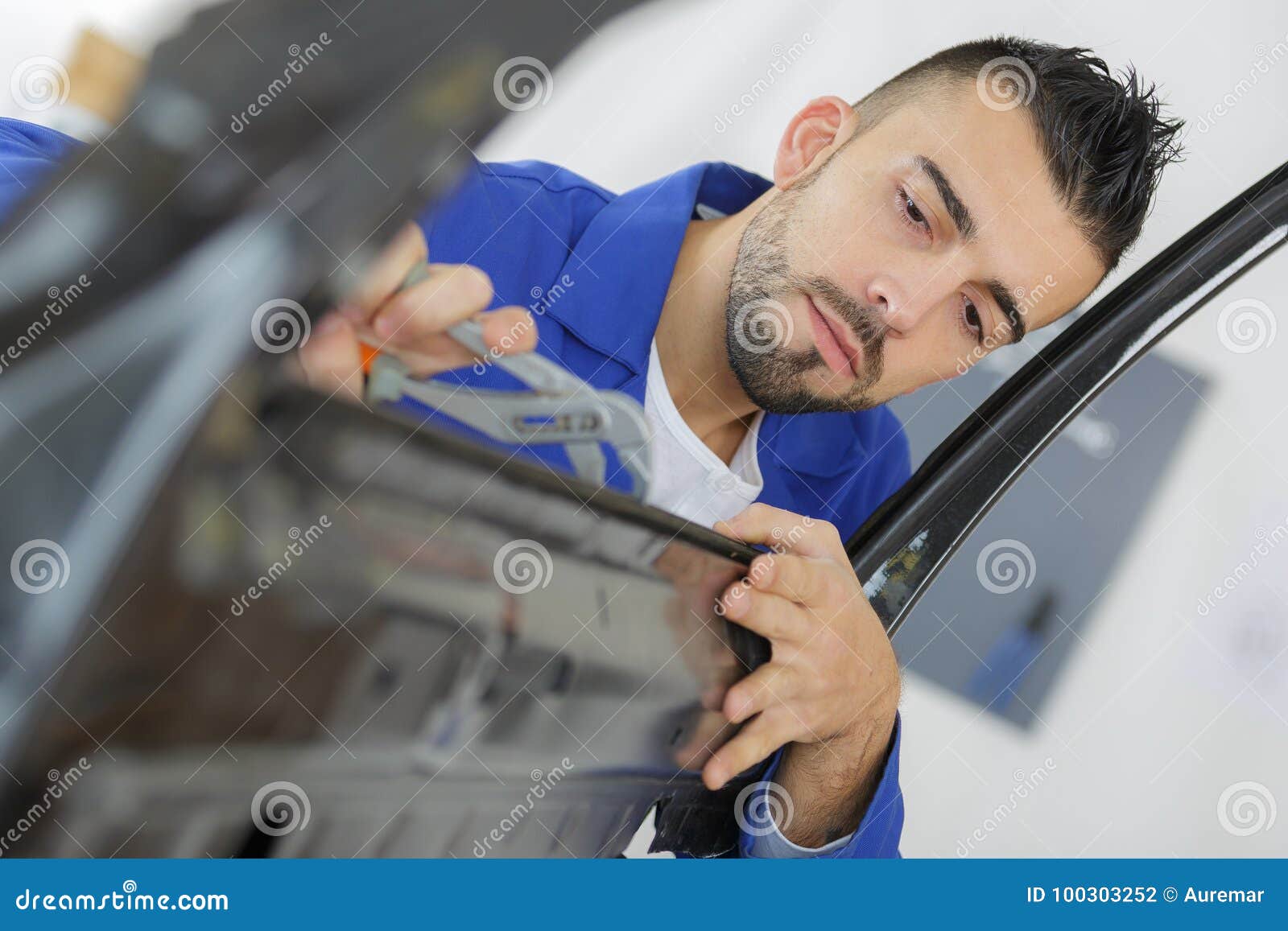 Worker inspecting car body stock photo. Image of road - 100303252