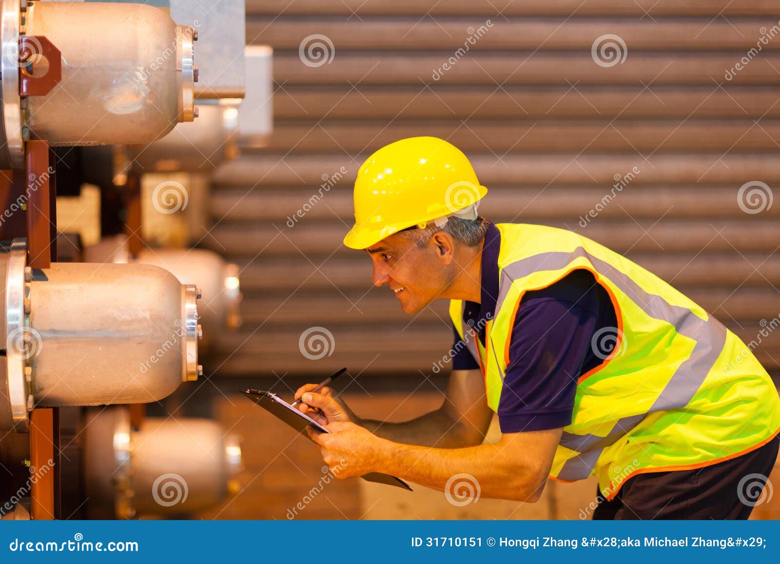 Worker Inspecting Machinery Stock Image - Image of adult, male: 31710151