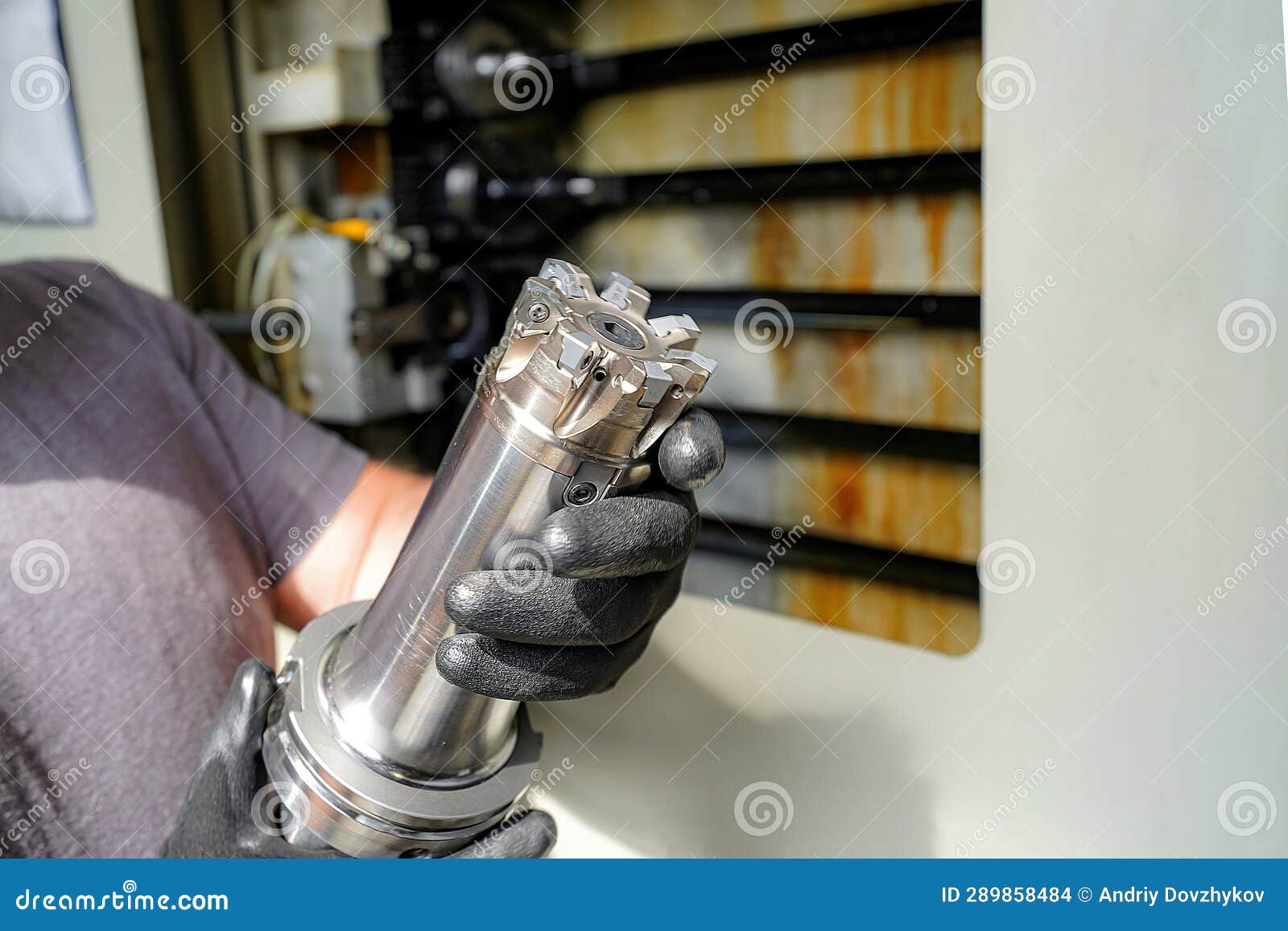 A Worker Inspects and Changes a High-speed Cutter on a CNC Milling ...