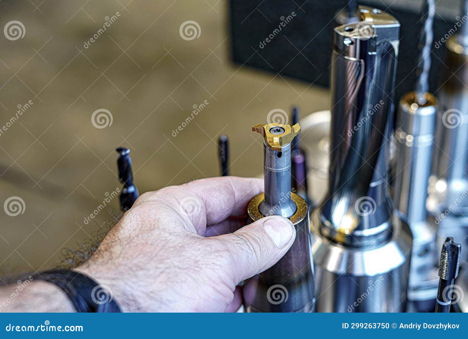 A Worker Inspects Tools for Working on a CNC Milling Machine Stock ...