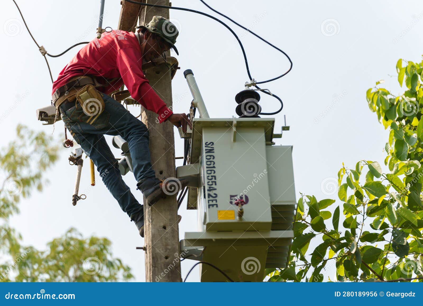 Worker Install a Three-phase Current Transformer on the Electric Pole ...