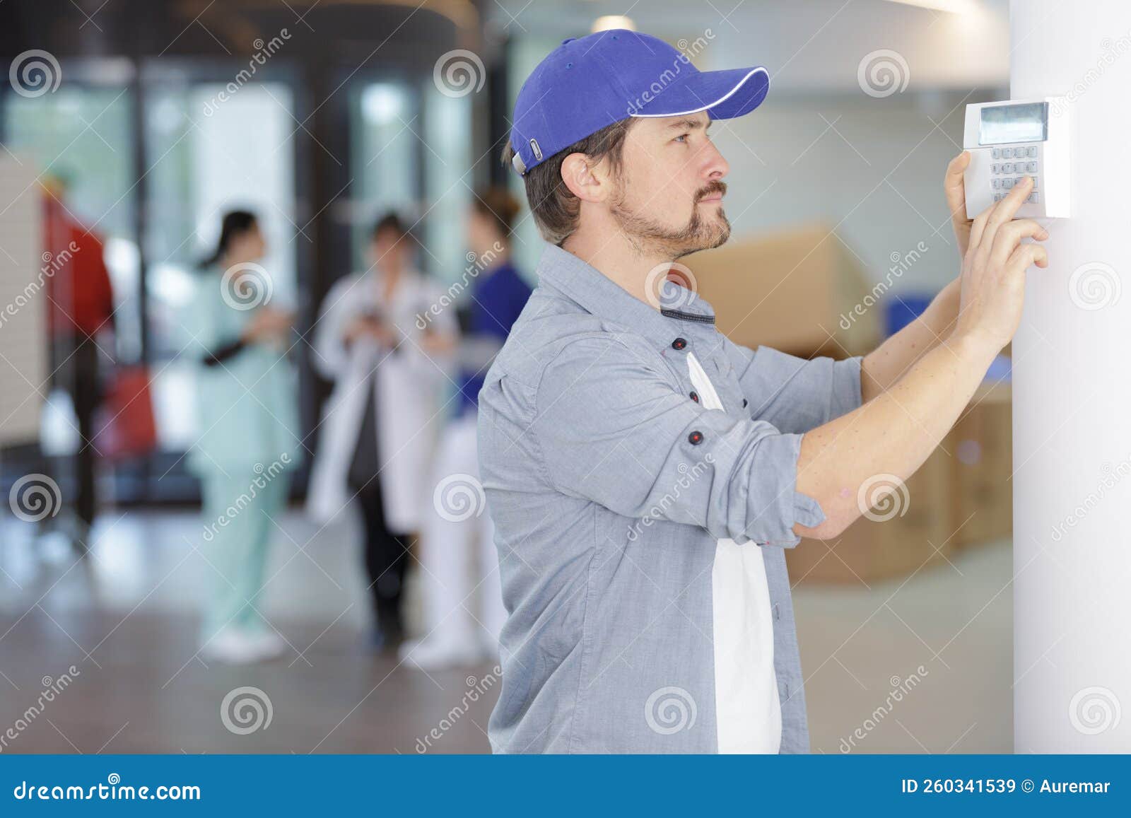 Worker Installing Alarm System in Hospital Stock Image - Image of ...