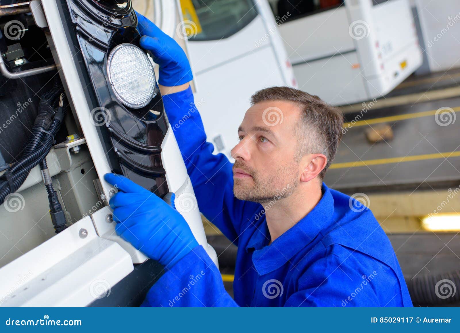 Worker Installing Bus Light Stock Image - Image of mechanic, light ...
