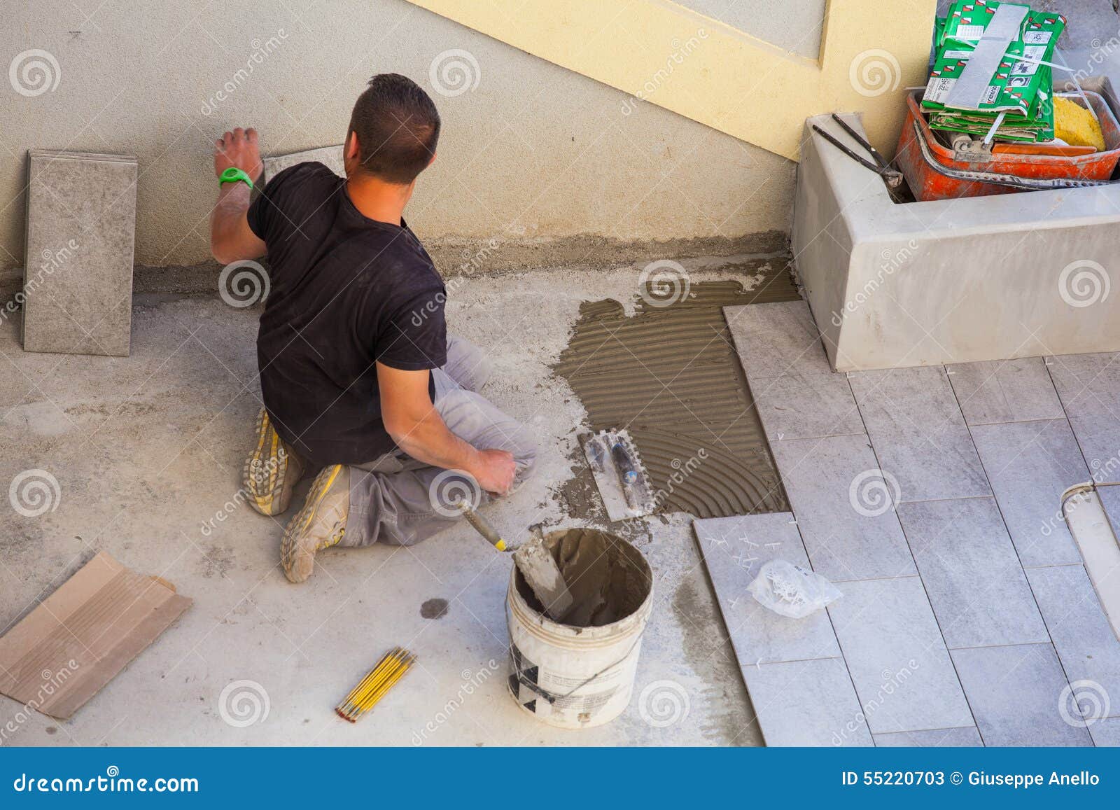 Worker Installing Ceramic Floor Tiles Editorial Stock Photo - Image of ...
