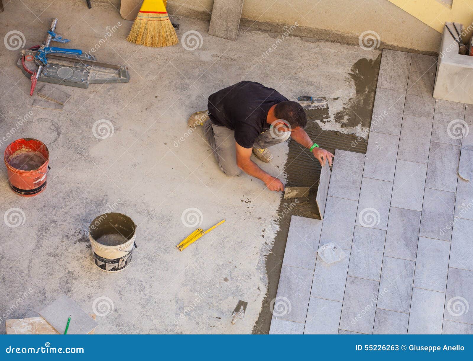 Worker Installing Ceramic Floor Tiles Editorial Stock Photo - Image of ...