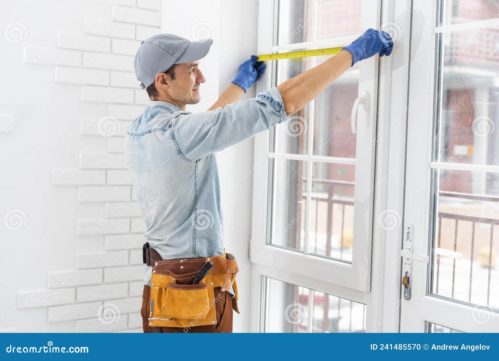 The Worker Installing and Checking Window in the House Stock Photo ...