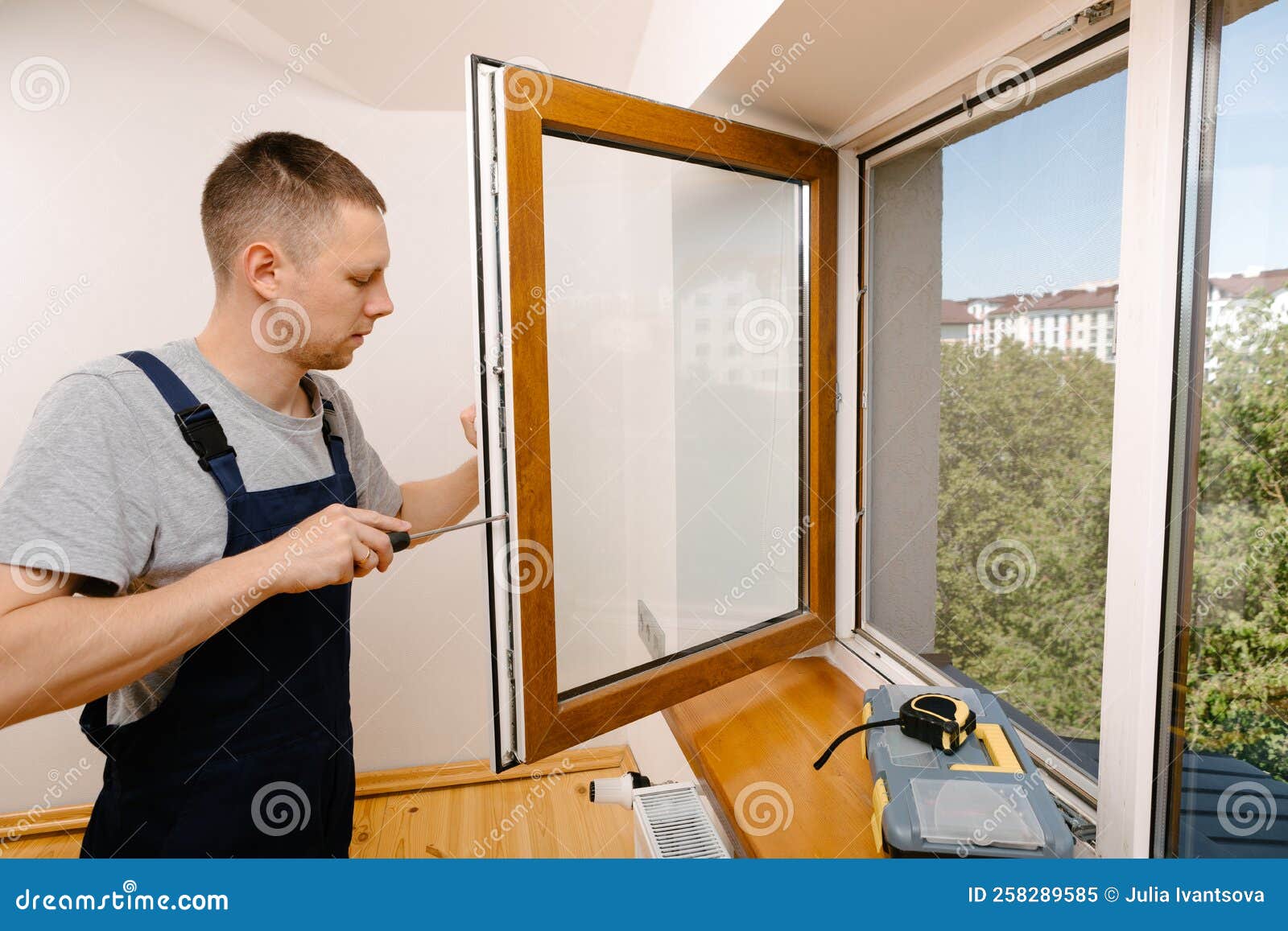 The Worker Installing and Checking Window in the House Stock Image ...