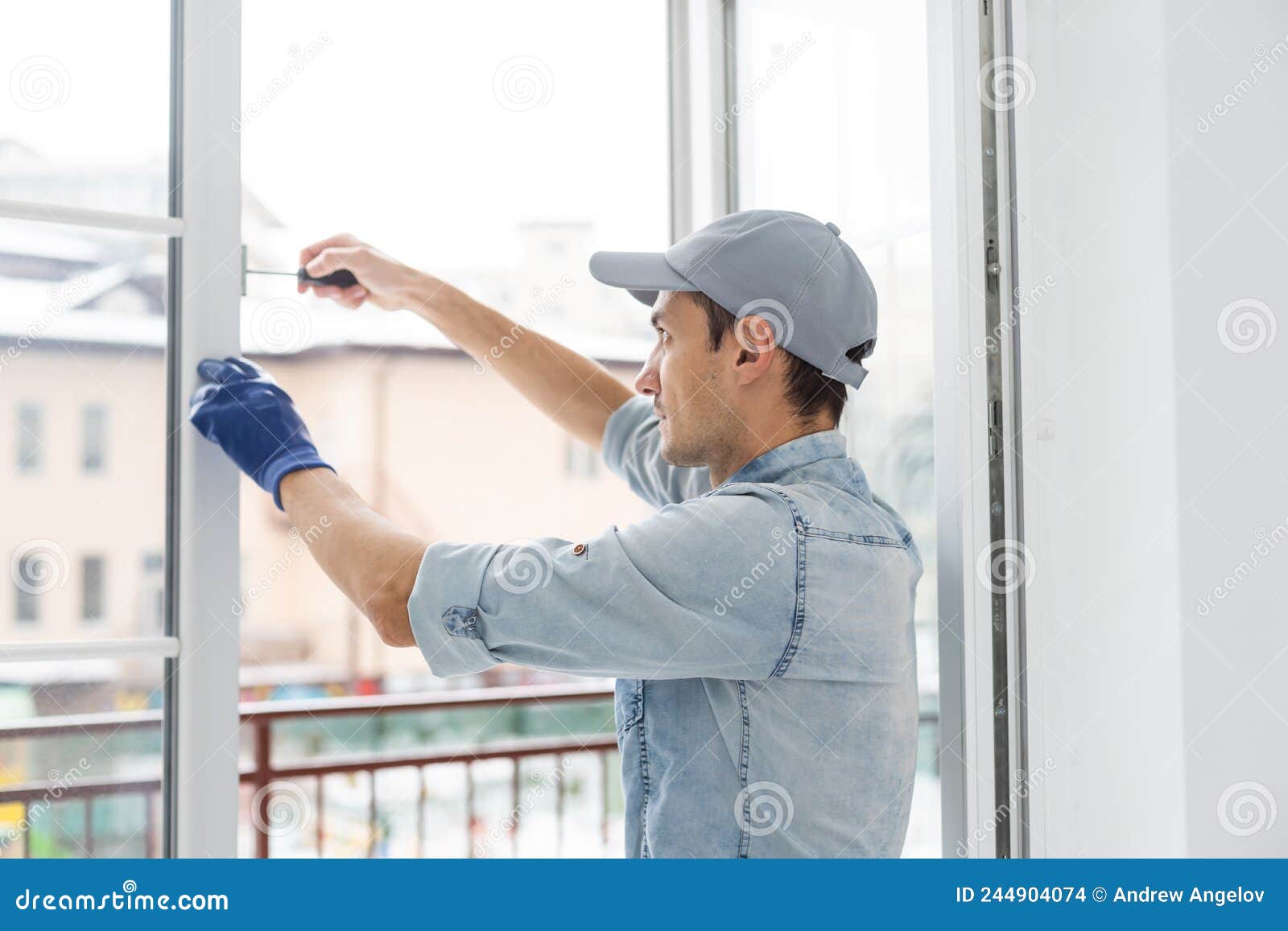 The Worker Installing and Checking Window in the House Stock Photo ...
