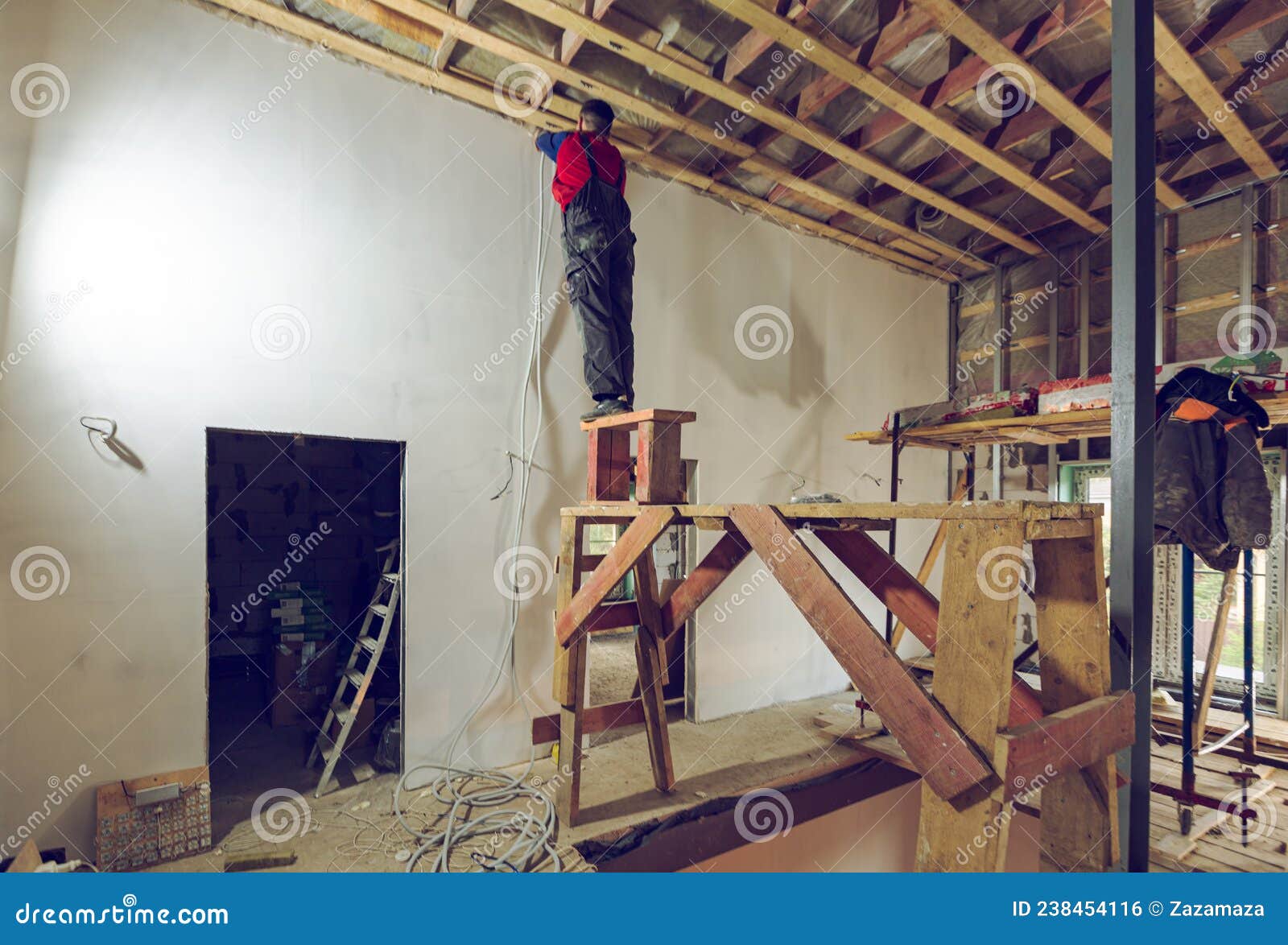 Worker is Installing the Electrical Wires on the Wall that is the Part ...