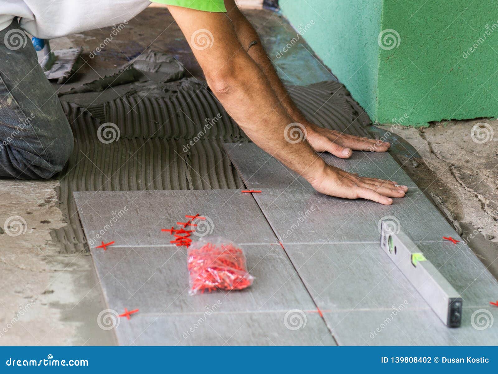 Worker Installing Floor Tiles Stock Photo - Image of constraction ...