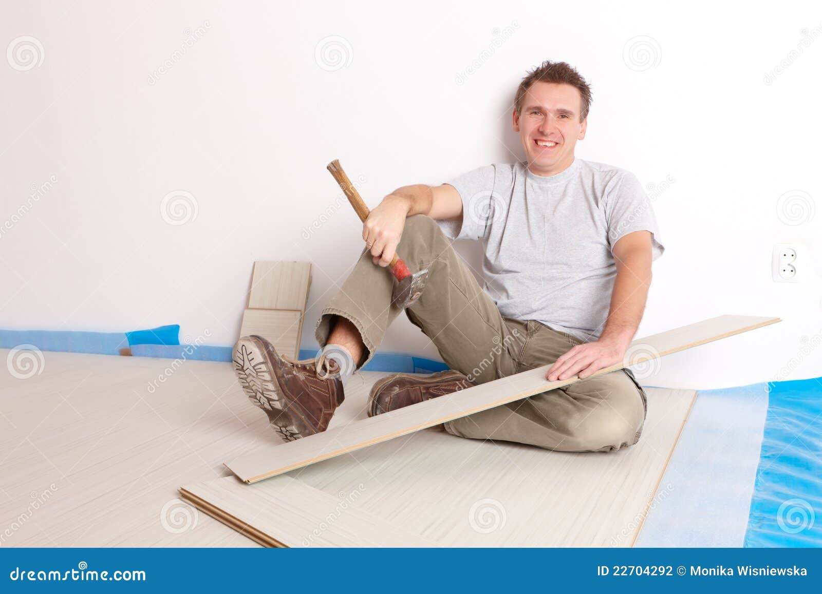 Worker Installing a Laminated Flooring Stock Photo - Image of ...