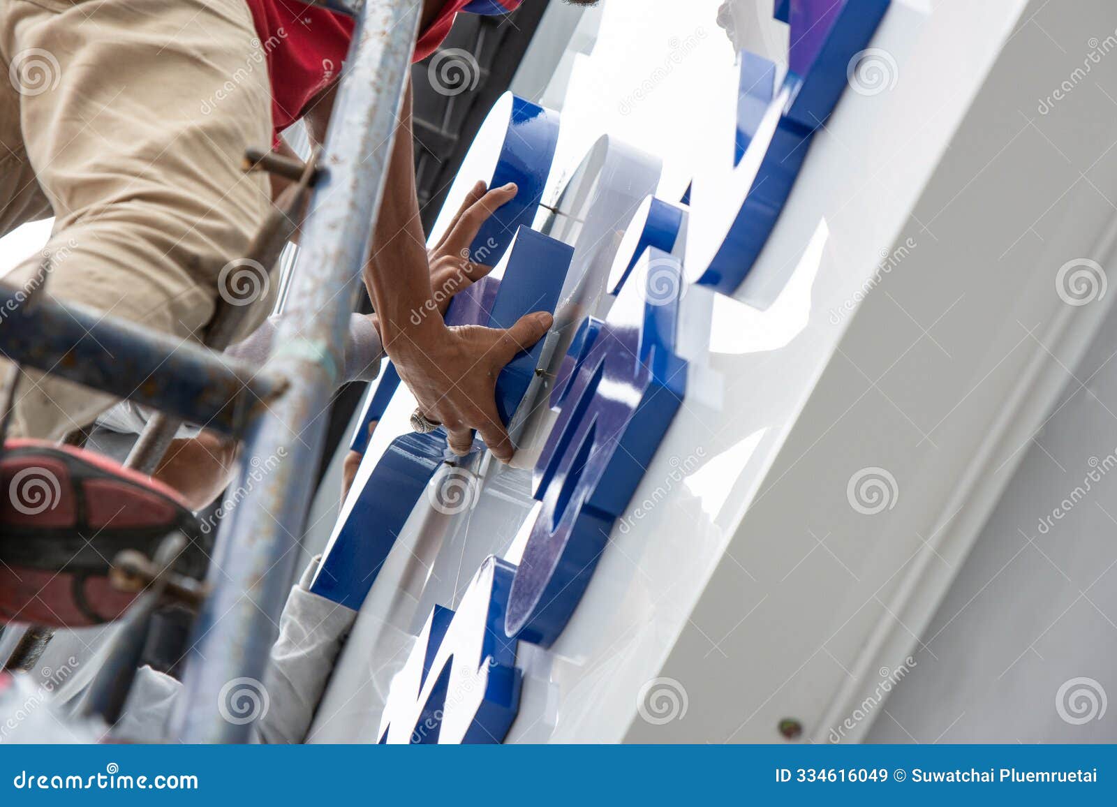 Worker Installing Lettering on Commercial Metal Sign Stock Image ...