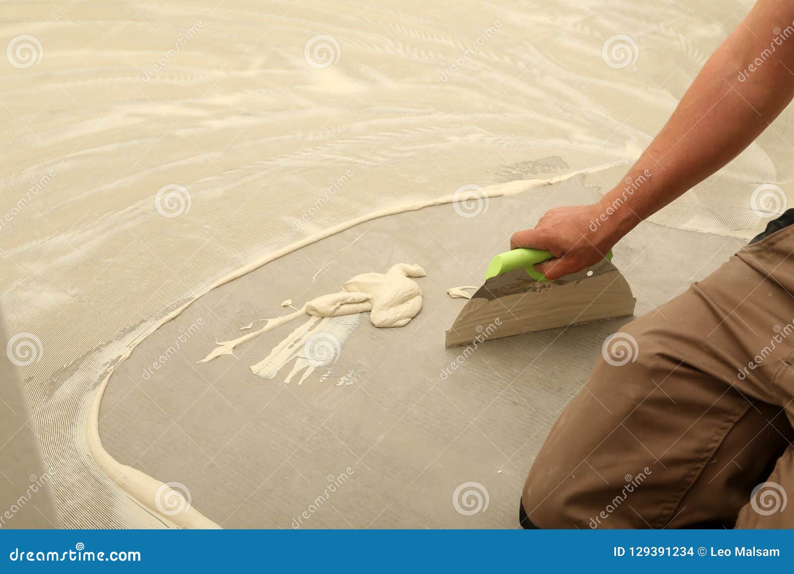 Work on Laying Flooring. Worker Installing New Vinyl Tile Floor. Stock ...