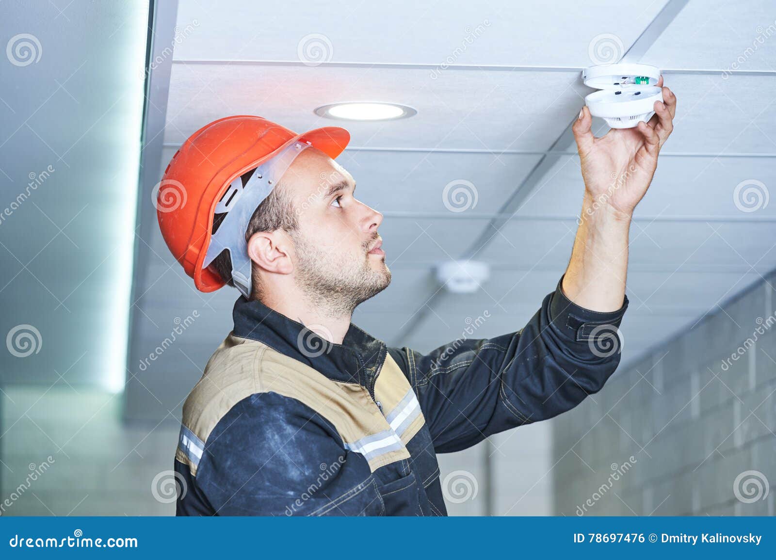 Worker Installing Smoke Detector on the Ceiling Stock Photo - Image of ...