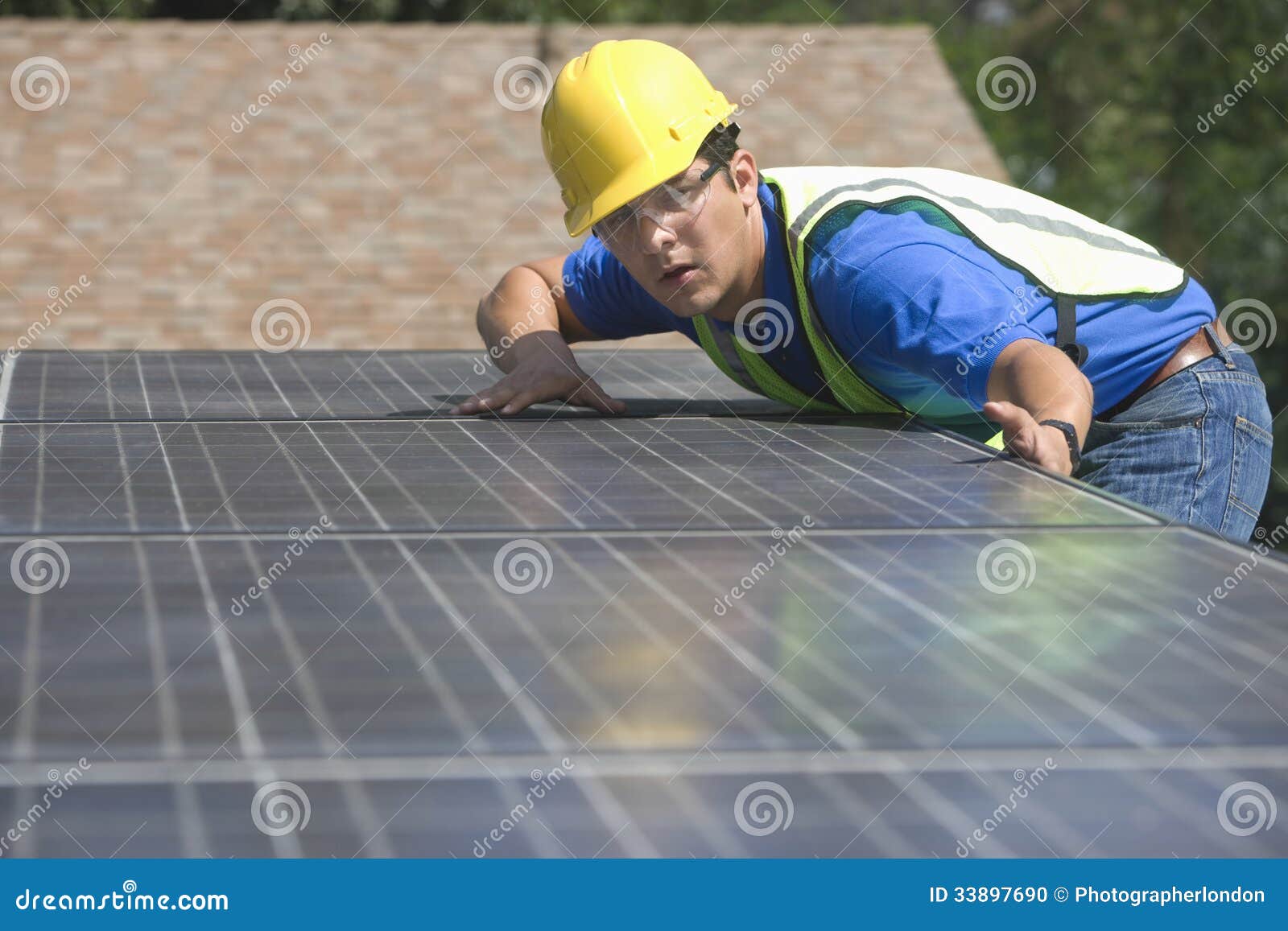 Worker Installing Solar Panels on Rooftop Stock Photo - Image of ...