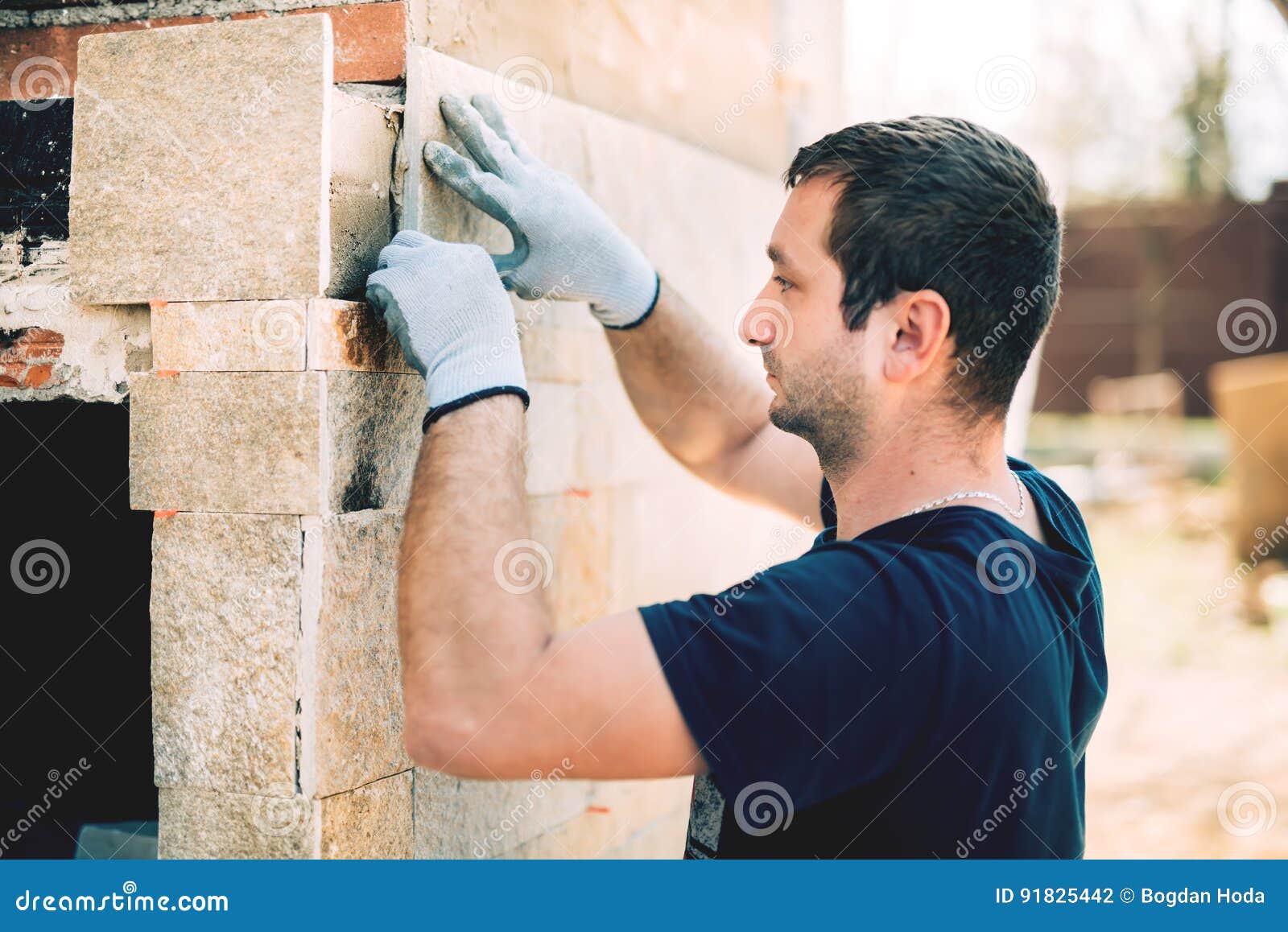 Worker Installing Stone on Architectural Facade of New Building ...