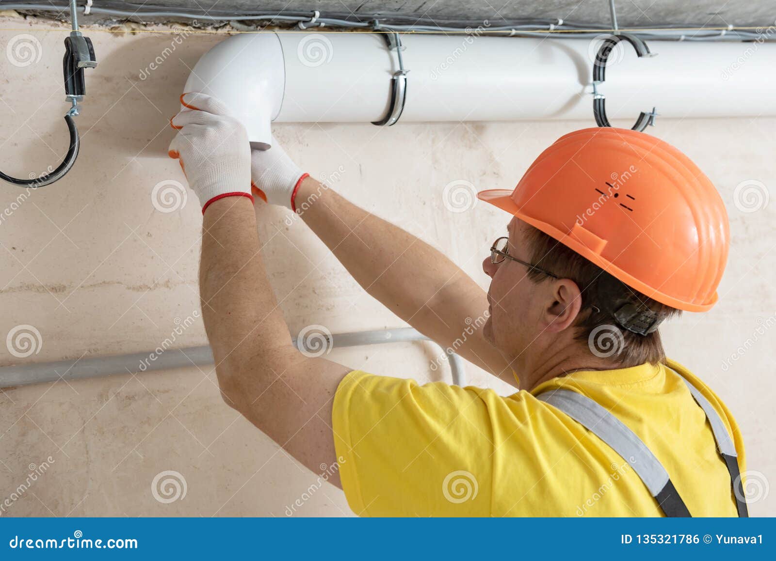 The Worker is Installing a Ventilation System Stock Photo - Image of ...