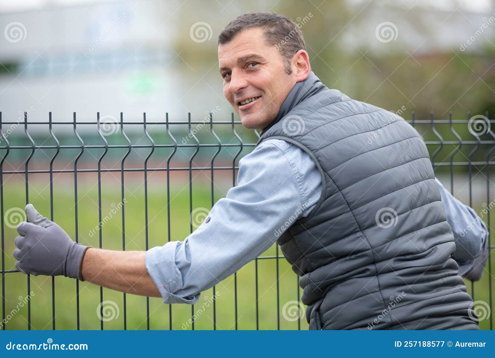 Worker Installing Welded Metal Mesh Fence Stock Image - Image of ...
