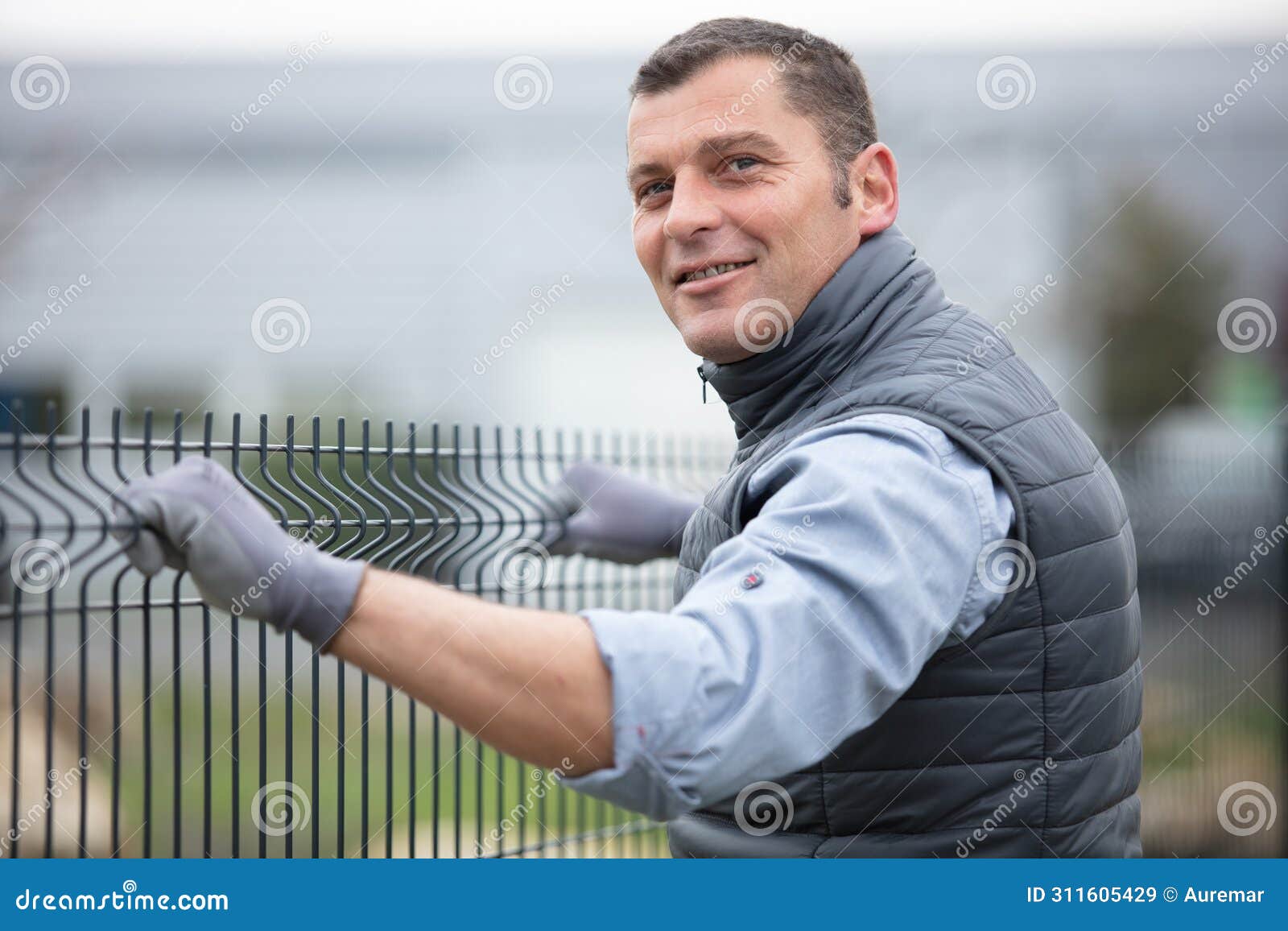 Worker Installing Welded Metal Mesh Fence Stock Image - Image of grid ...