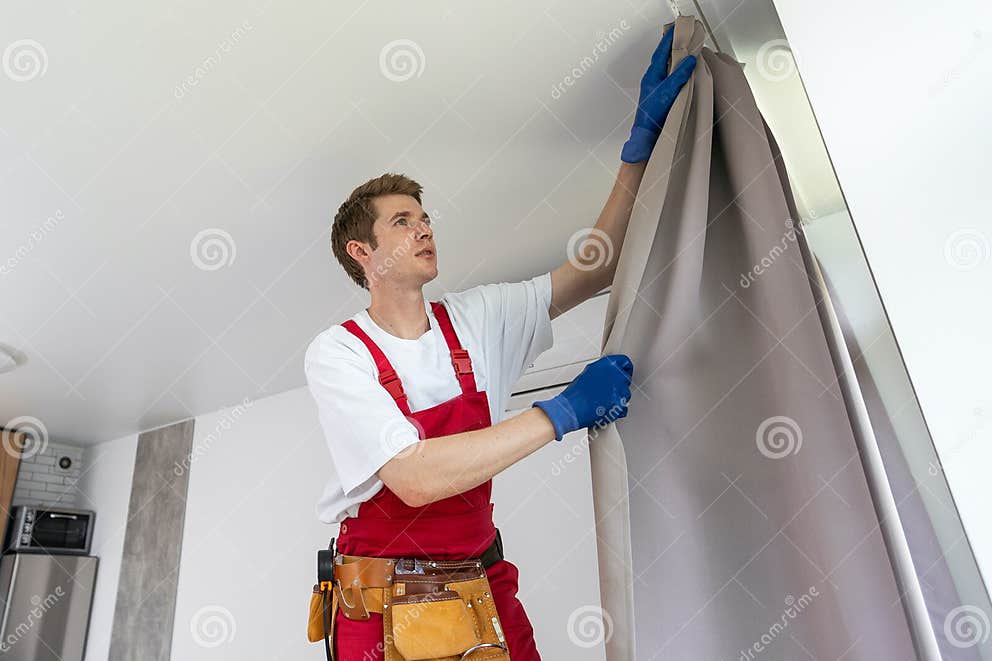 Worker Installing Window Curtain Rod on the Wall Stock Photo - Image of ...