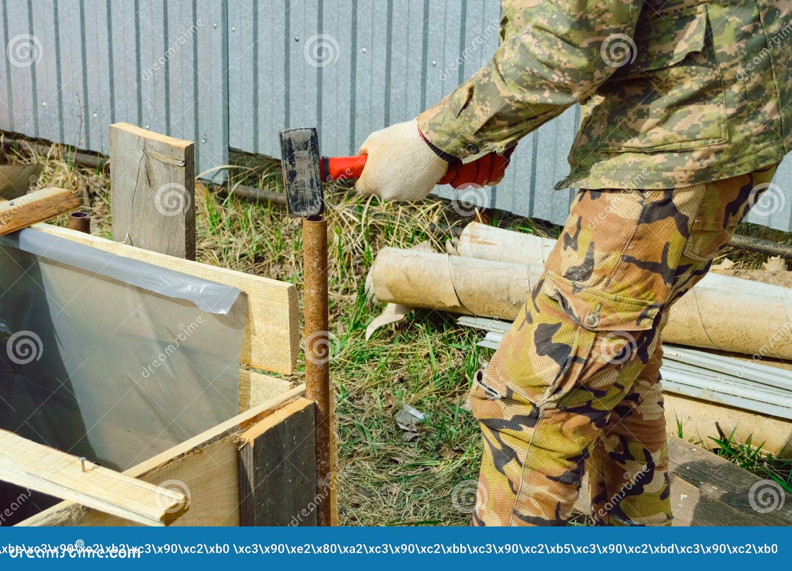 Worker Installs Formwork, Hammer an Iron Pipe - Support Stock Image ...