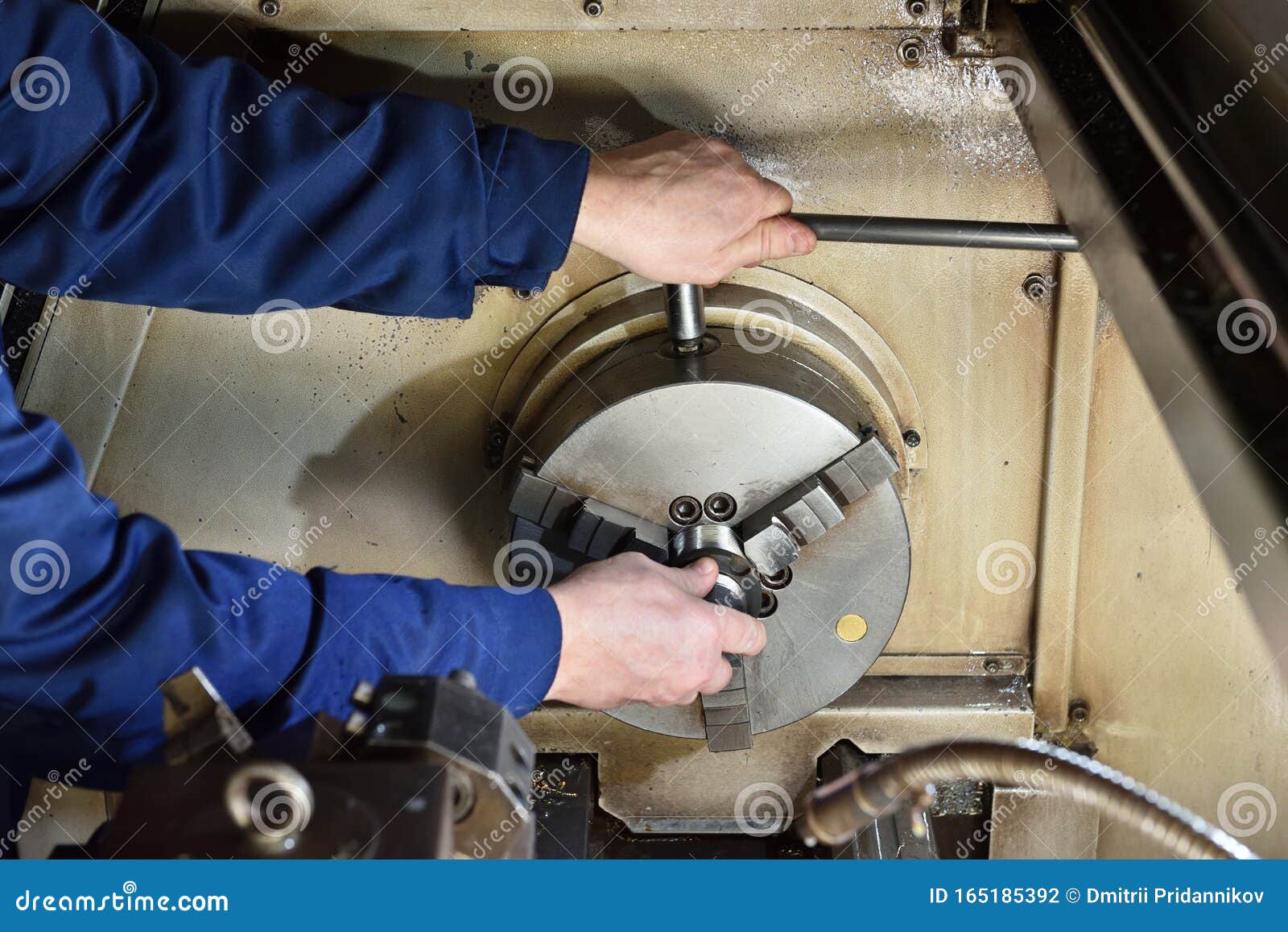 The Worker Installs a New Metal Part in the Chuck Spindles for ...