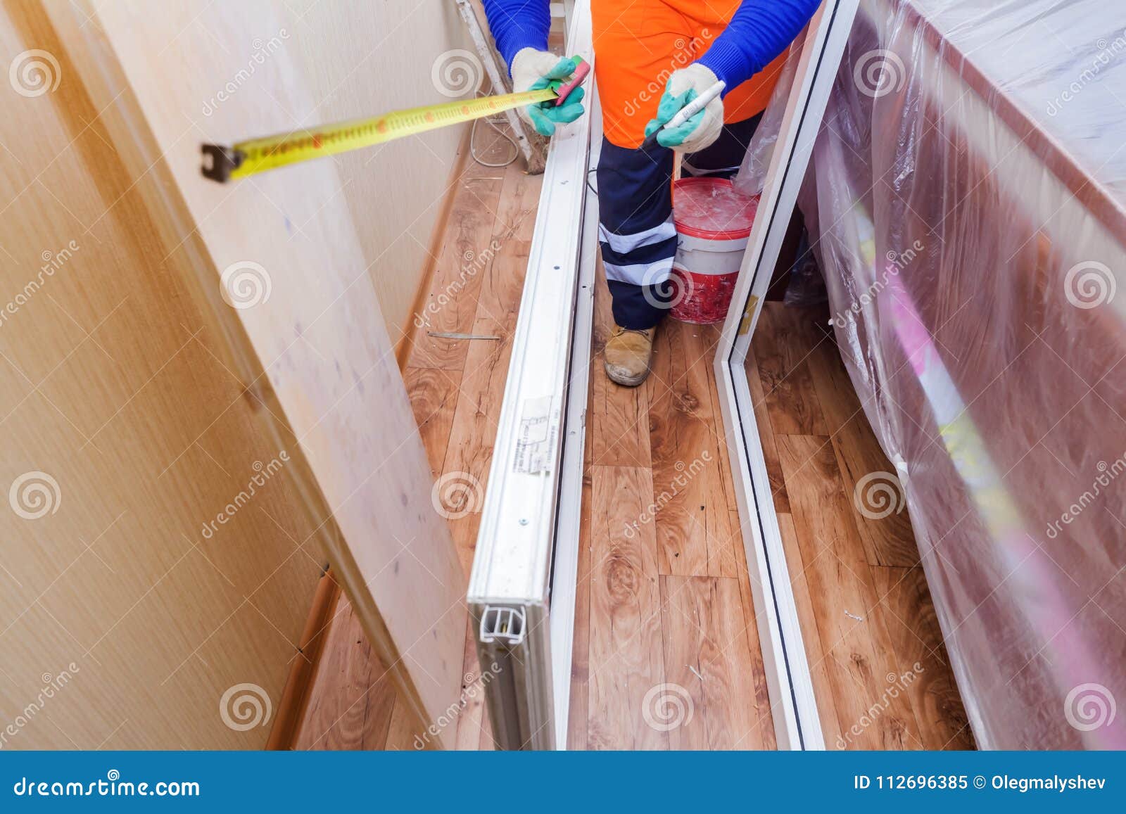 The Worker Installs Plastic Windows and Doors Stock Image - Image of ...
