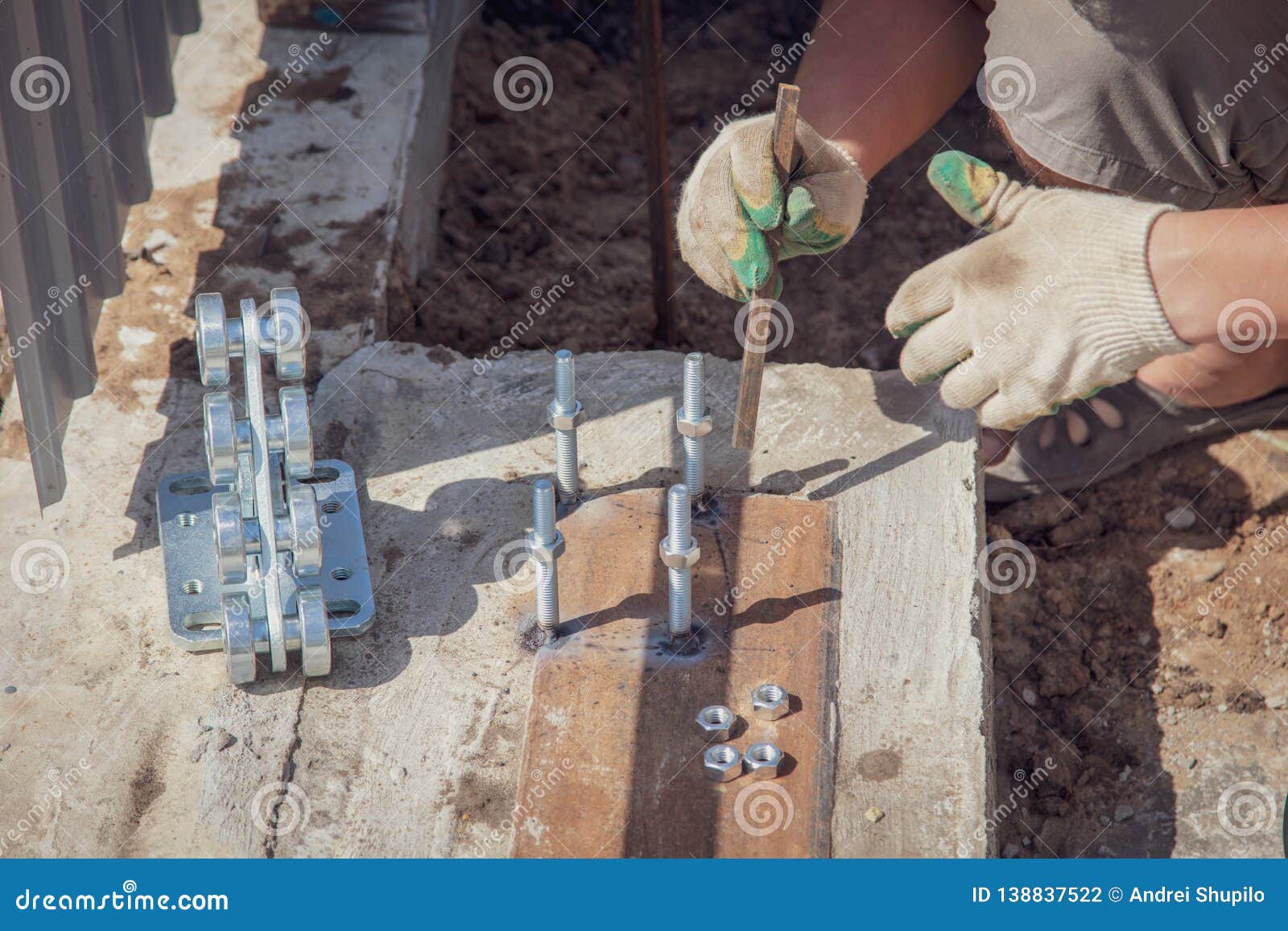 The Worker Installs Rollers on the Sliding Gate Stock Photo - Image of ...