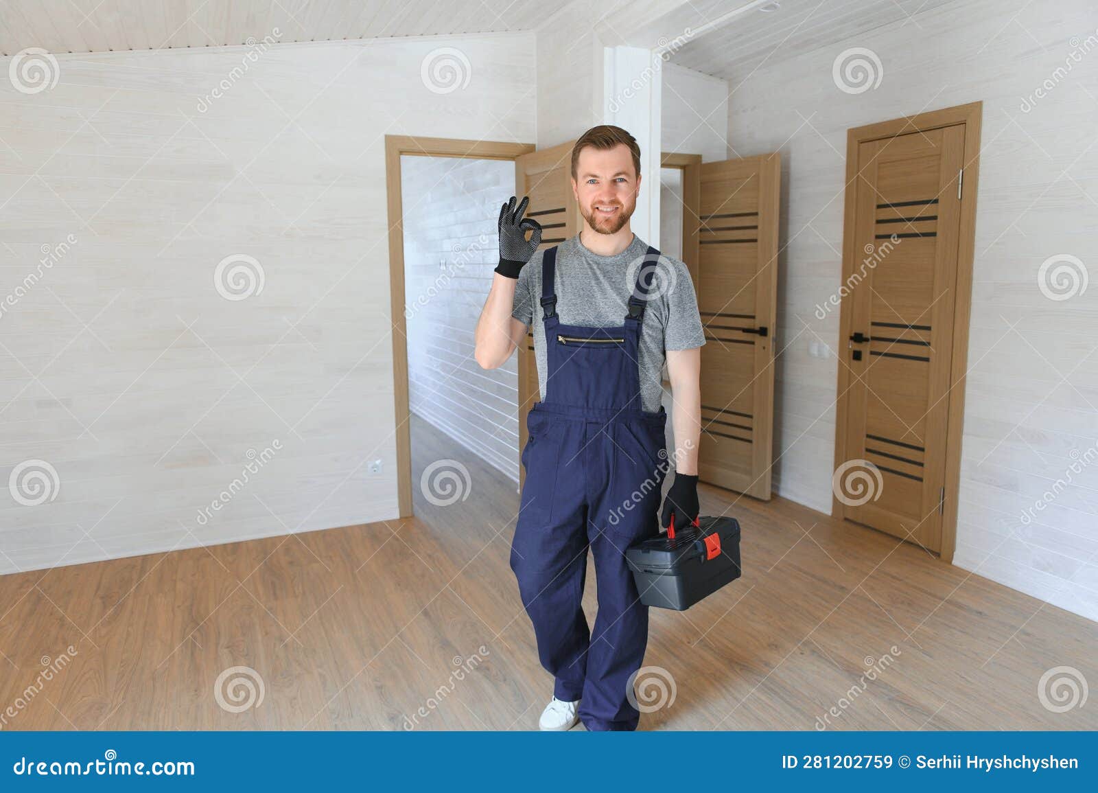 A Worker Installs Windows in a New Modular Home. the Concept of a New ...