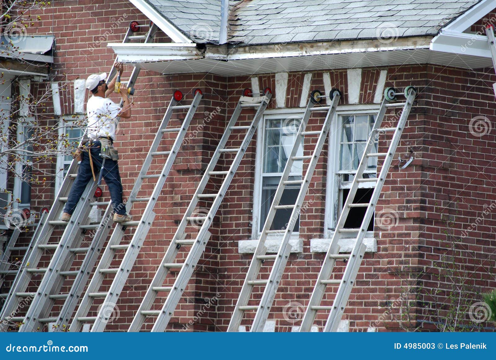 Worker on a ladder stock image. Image of drill, fixing - 4985003