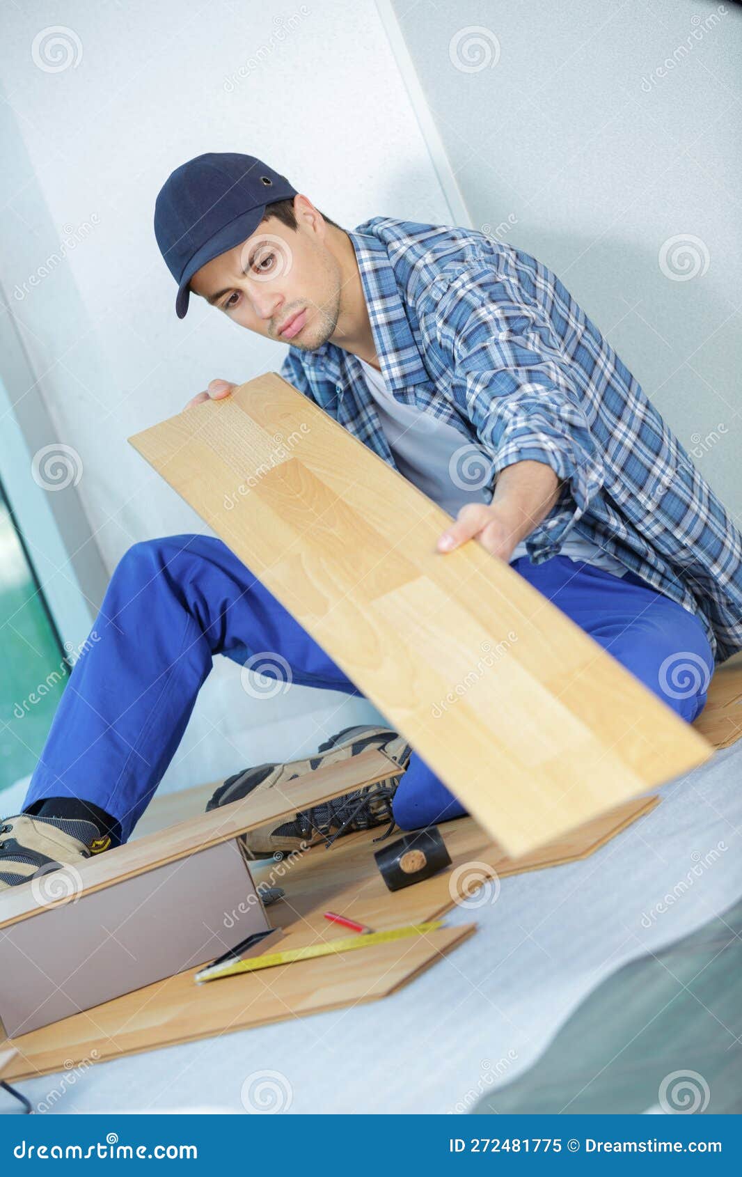 Worker with Laminate Sitting on Floor Stock Image - Image of equipment ...