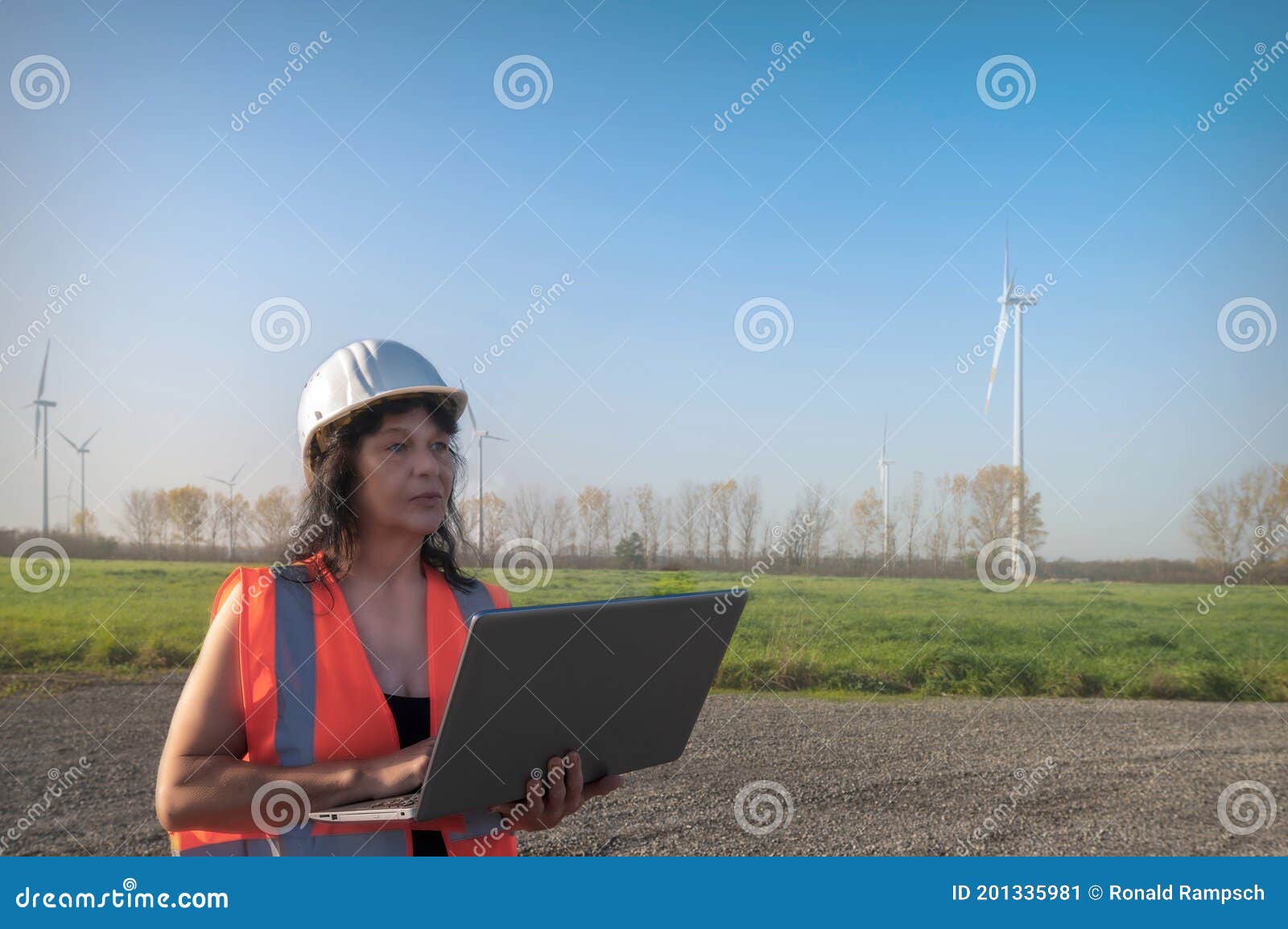Worker with Laptop in Wind Farm Stock Image - Image of person ...